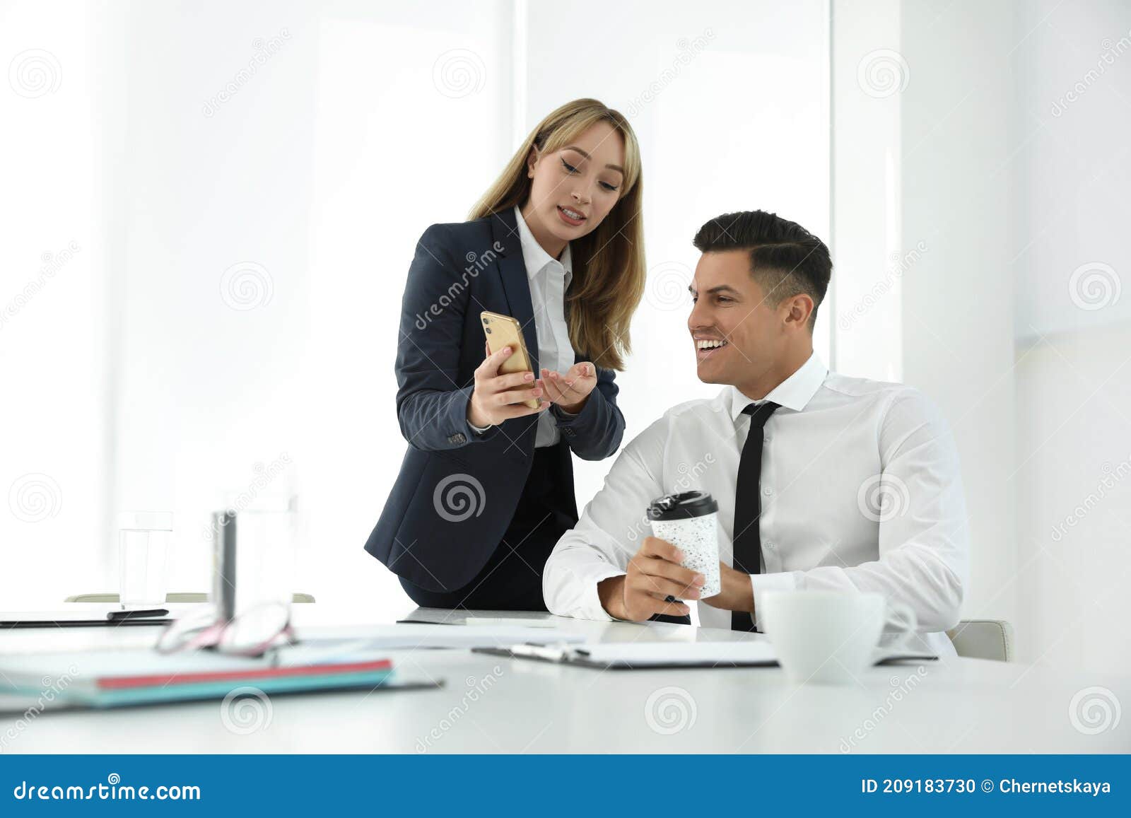 Office Employees Talking at Workplace during Break Stock Photo - Image ...