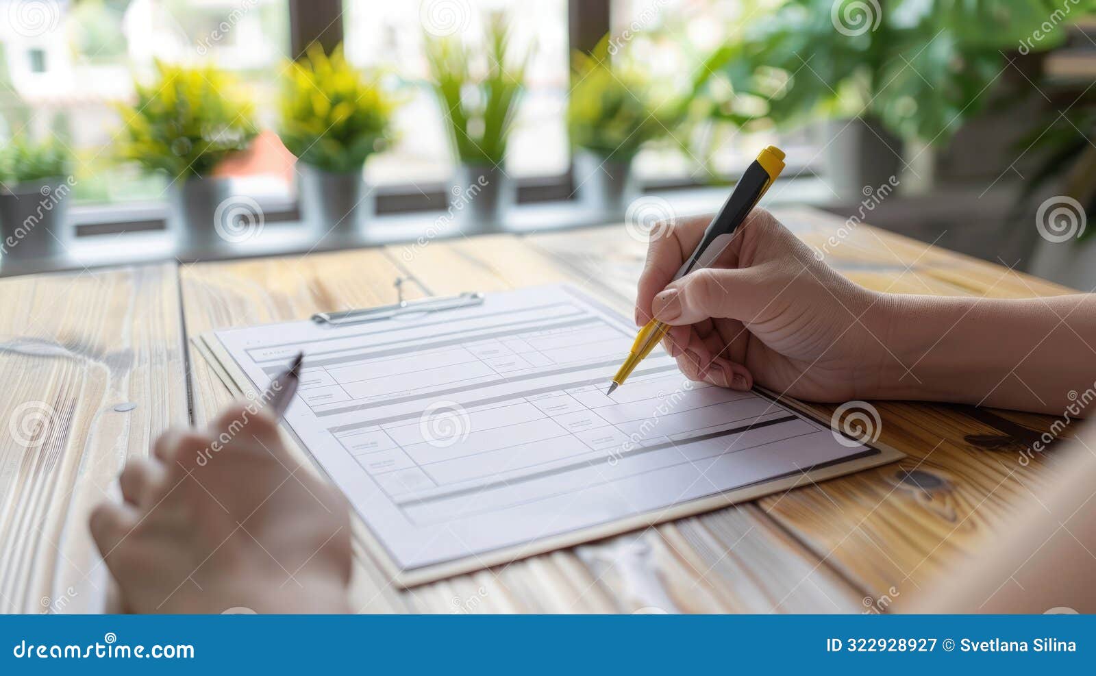 Office Environment with a Person Highlighting Sections of a Printed ...