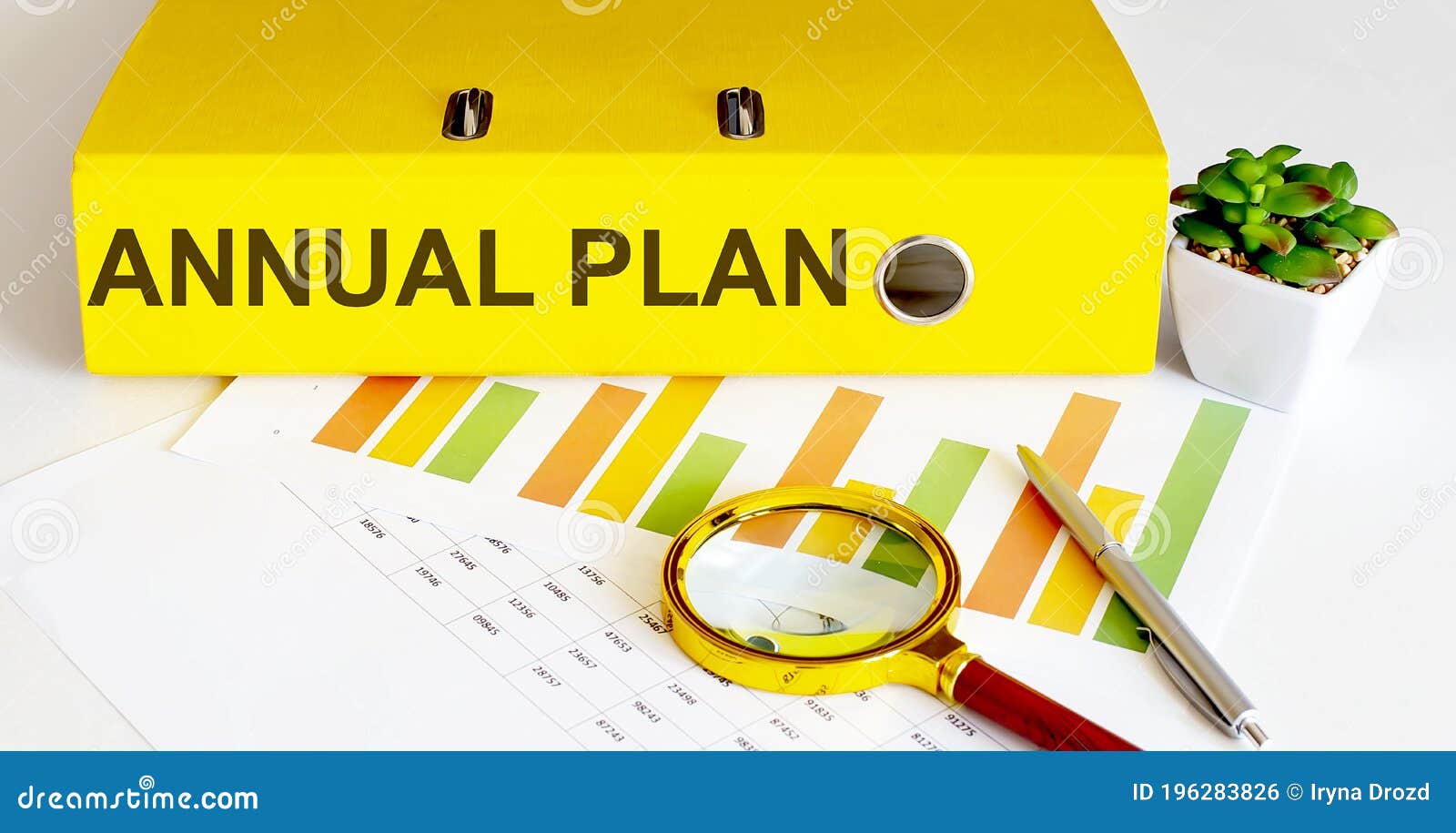 Office Folder with Text ANNUAL PLAN with Charts, Magnifier and Pen ...