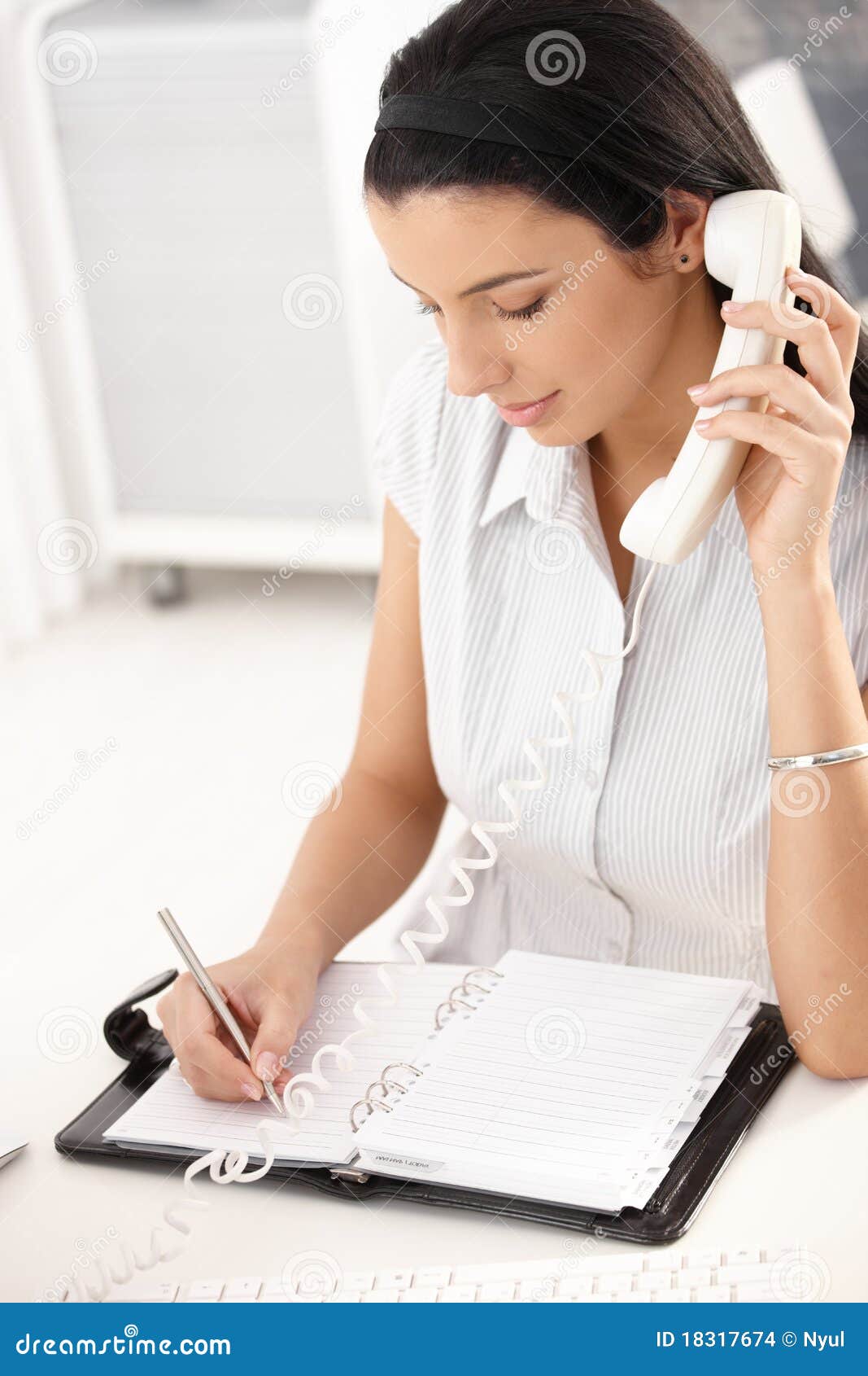 Office girl taking notes stock photo. Image of businesswoman - 18317674
