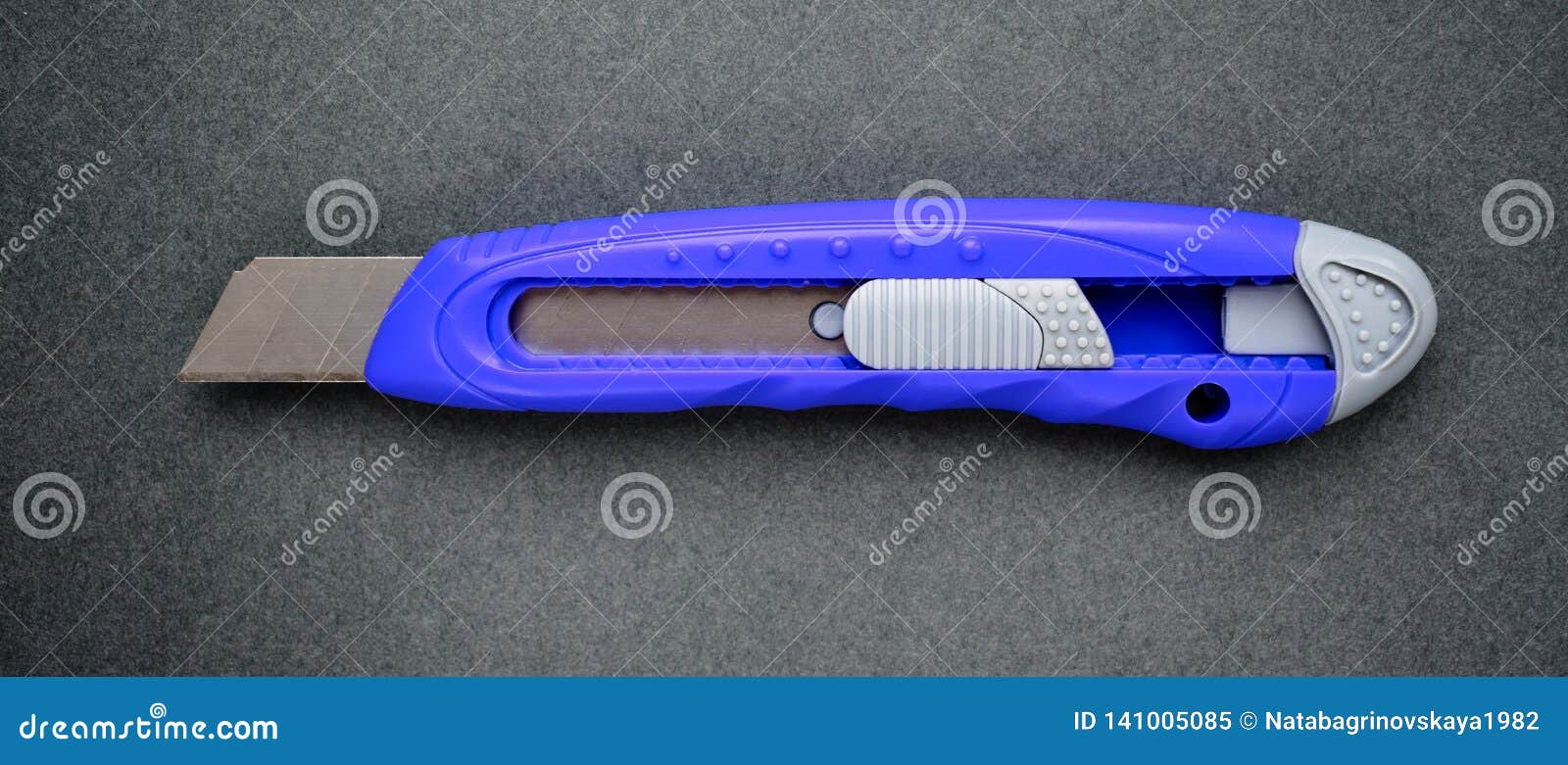 Office Knife on Grey Background Blue Blade Stock Image - Image of ...