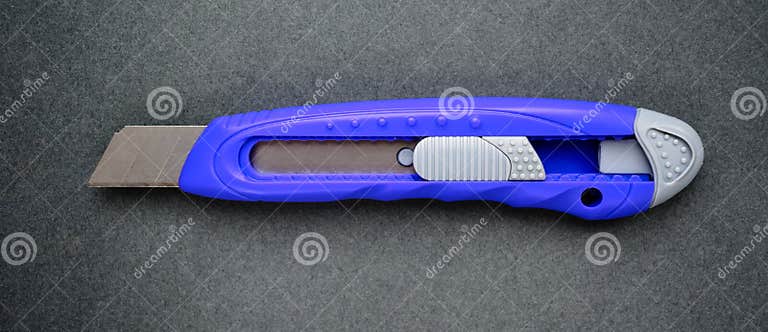 Office Knife on Grey Background Blue Blade Stock Image - Image of ...