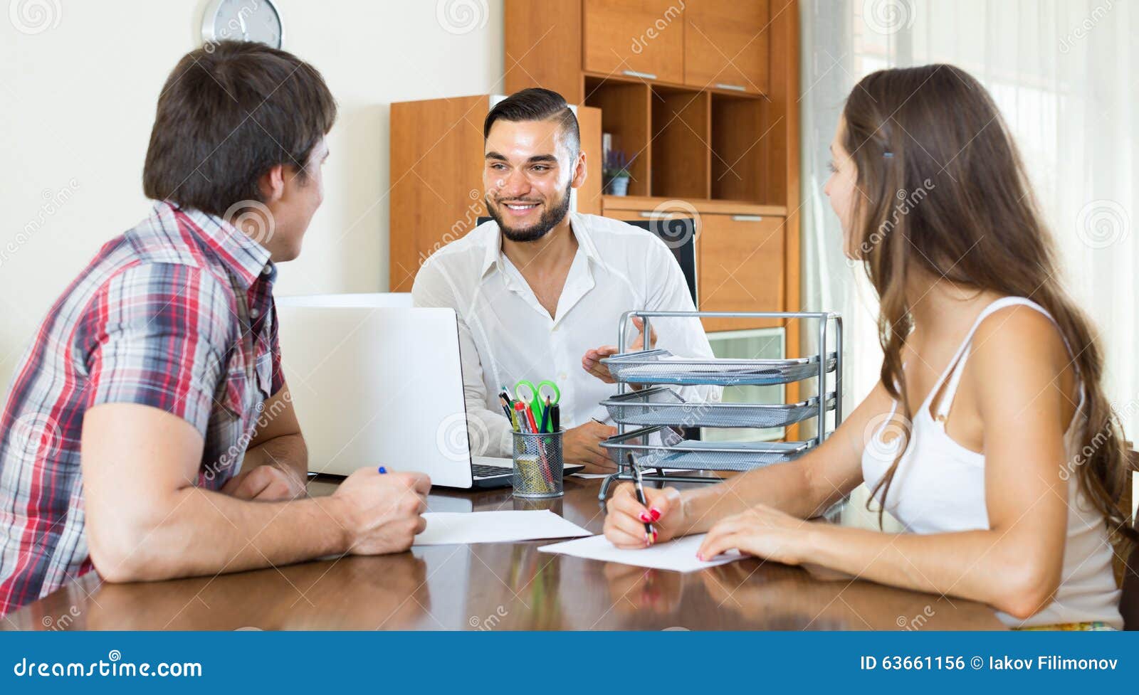Office Manager with Couple Signing Contract Stock Photo - Image of ...