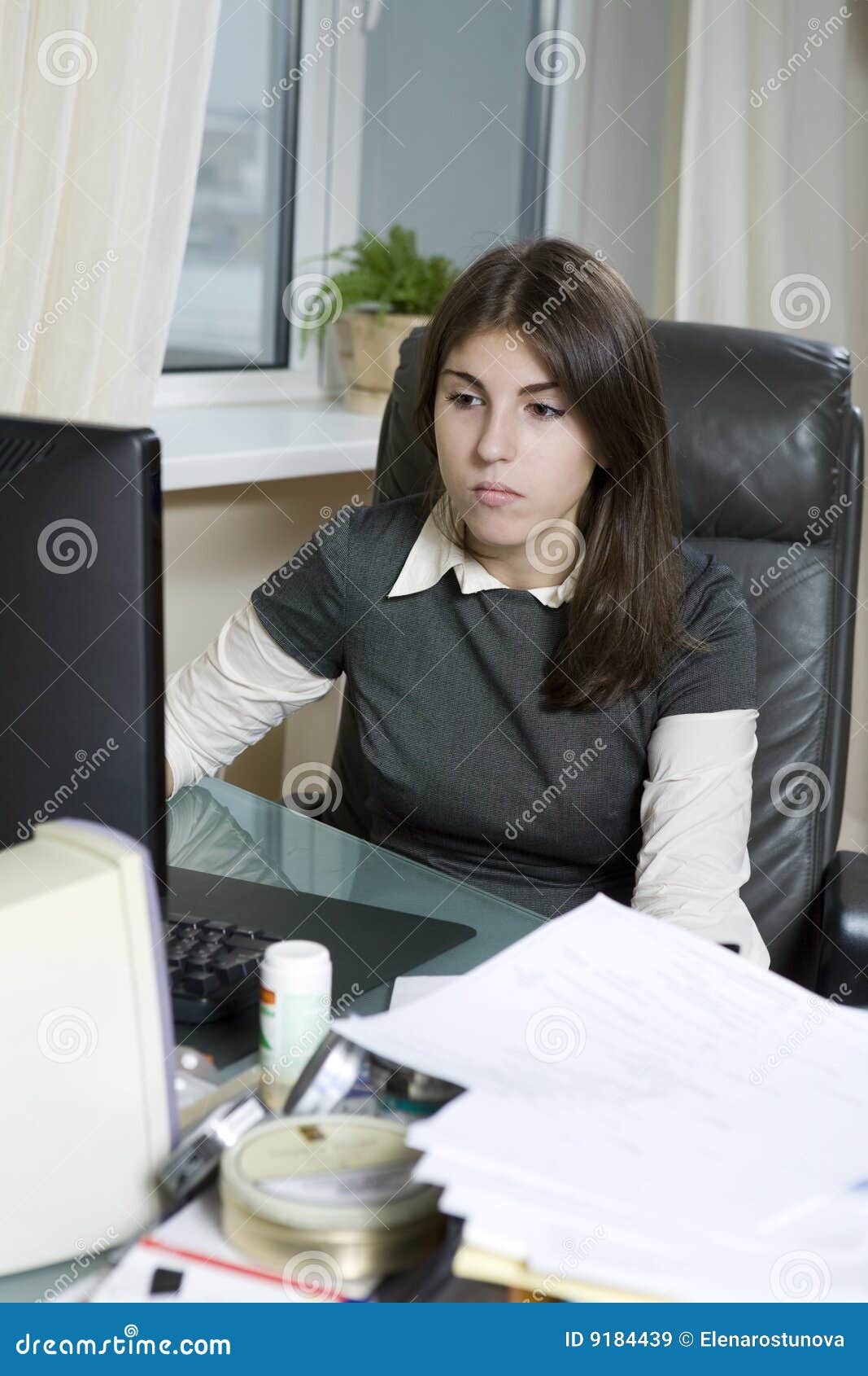 Concentrated Secretary At Workplace. Woman Work In Office On Laptop ...