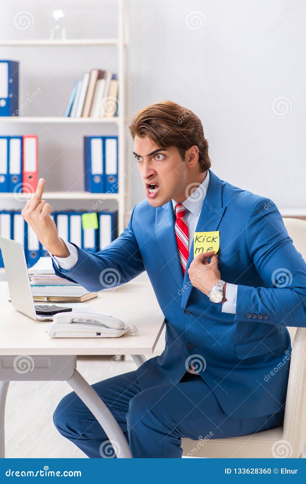 The Office Prank with Kick Me Message on Sticky Note Stock Photo ...