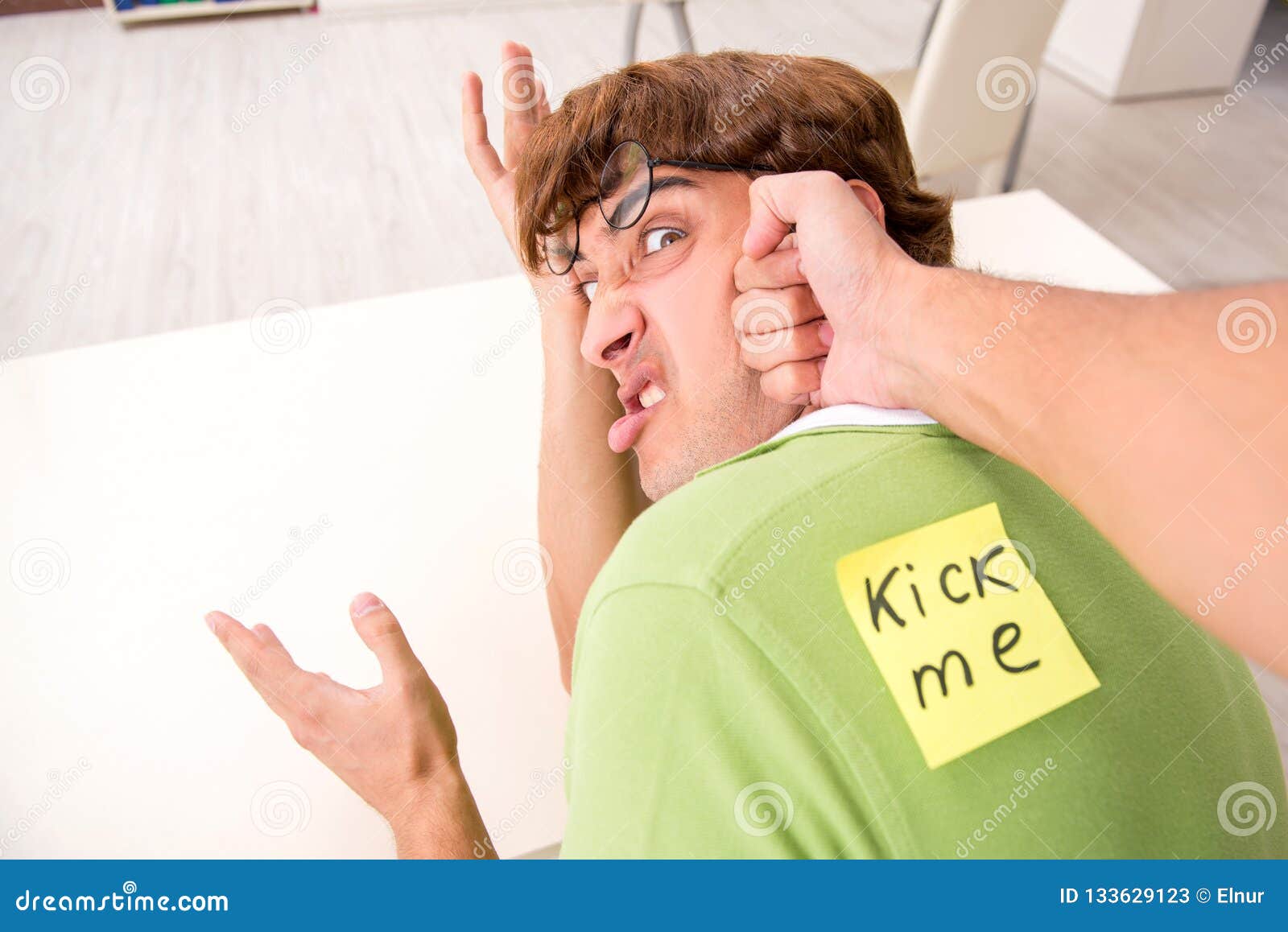 The Office Prank with Kick Me Message on Sticky Note Stock Image ...
