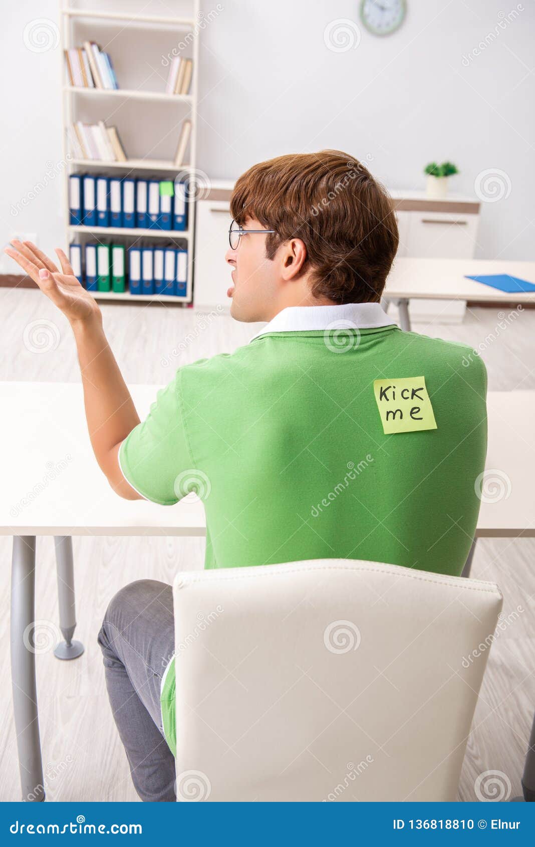 The Office Prank with Kick Me Message on Sticky Note Stock Photo ...