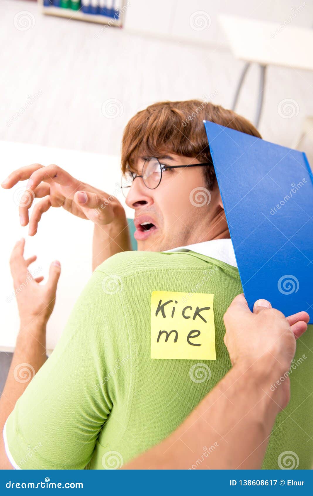 The Office Prank with Kick Me Message on Sticky Note Stock Image ...