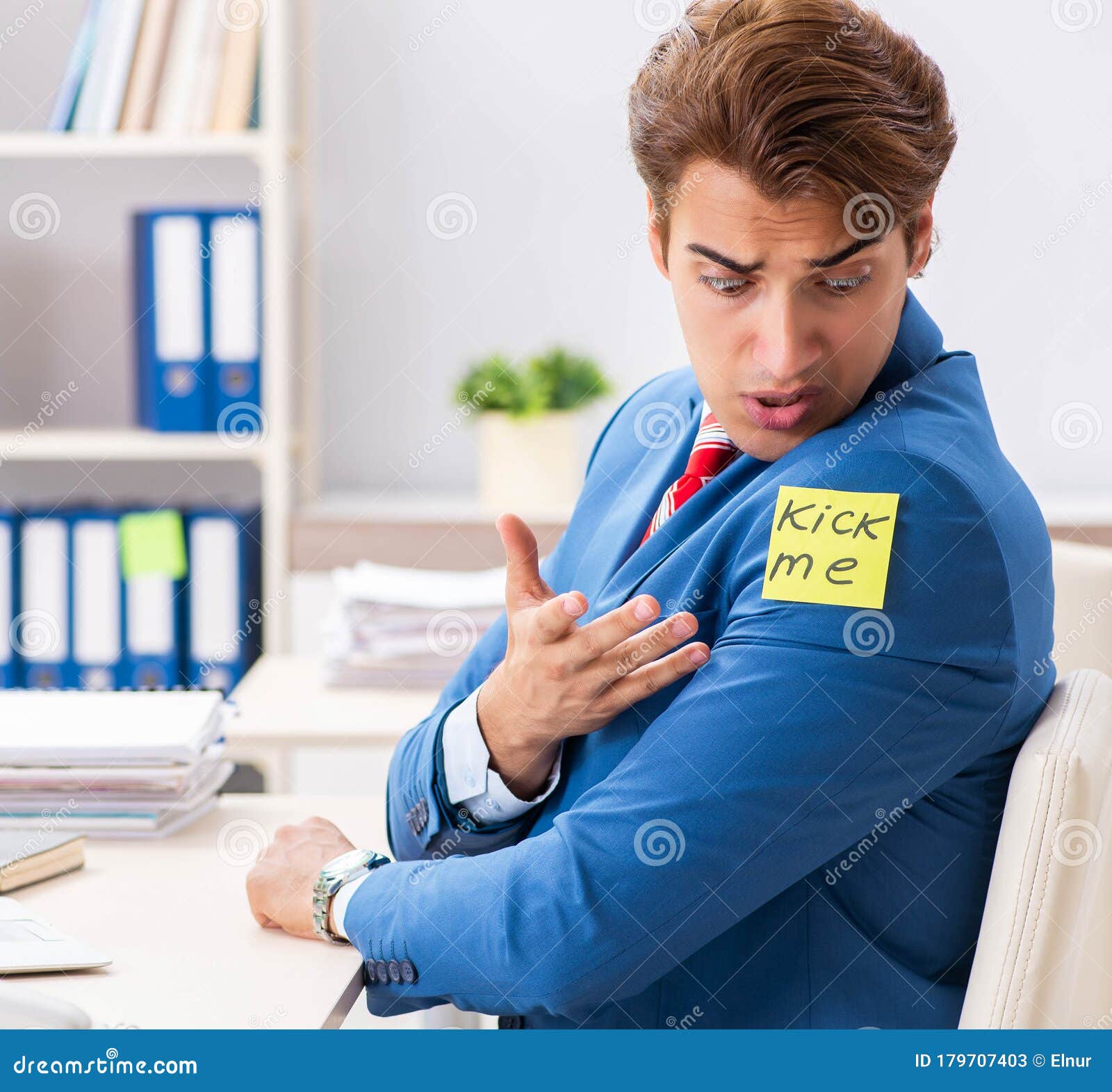 Office Prank with Kick Me Message on Sticky Note Stock Image - Image of ...
