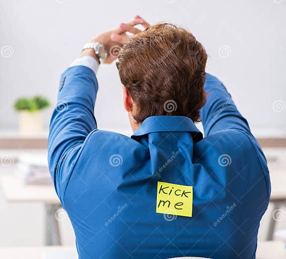 Office Prank with Kick Me Message on Sticky Note Stock Image - Image of ...