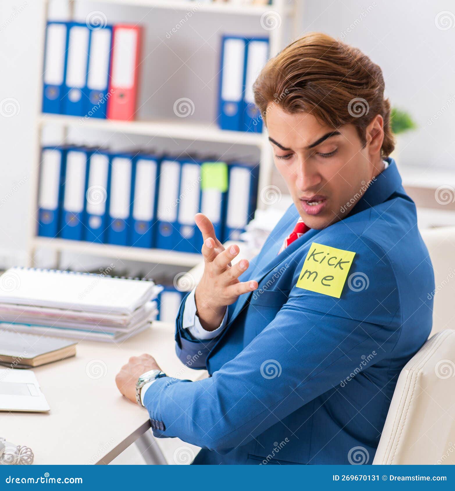 Office Prank with Kick Me Message on Sticky Note Stock Image - Image of ...