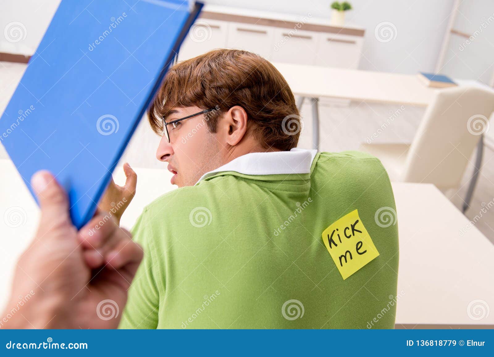 The Office Prank with Kick Me Message on Sticky Note Stock Image ...