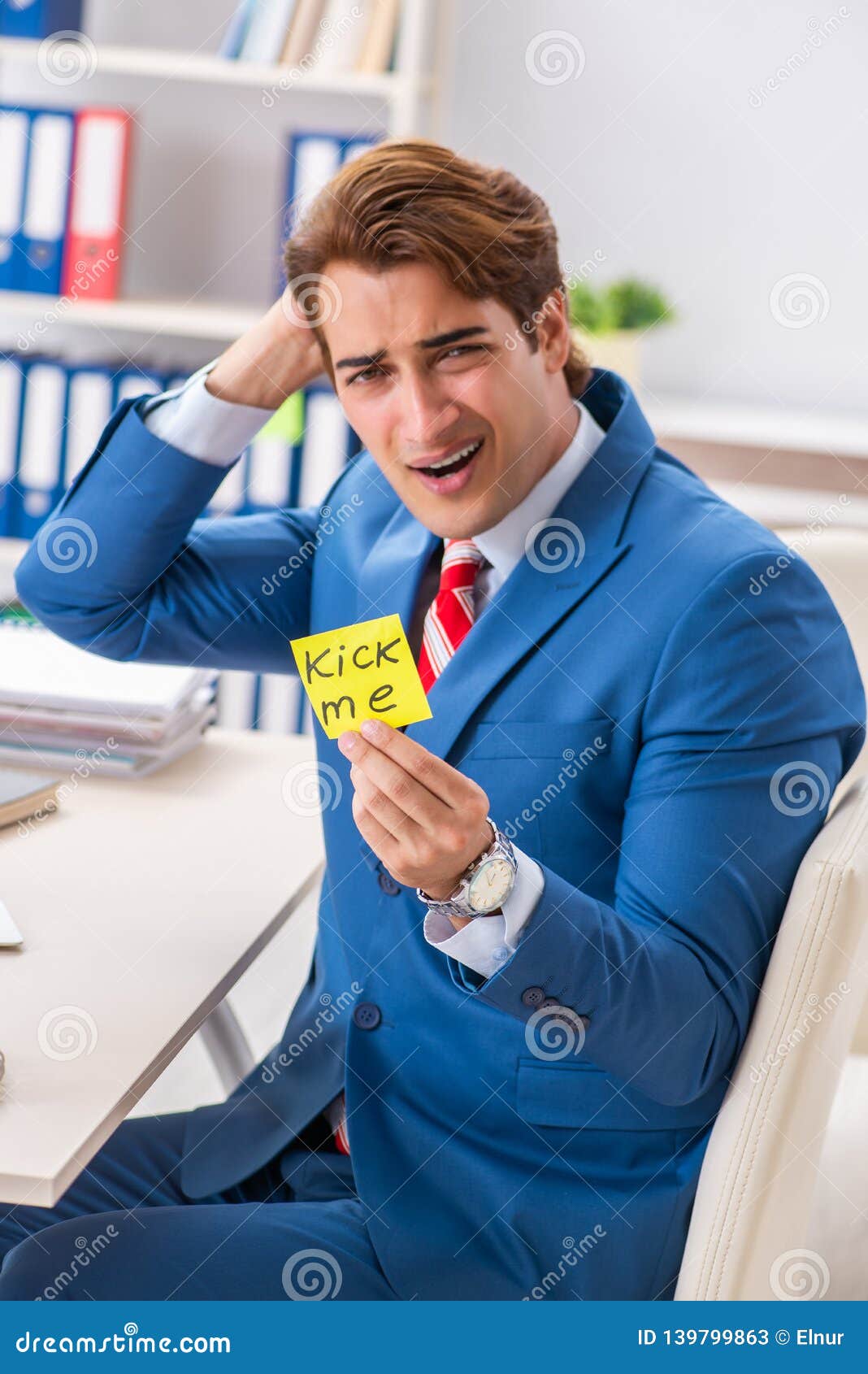 The Office Prank with Kick Me Message on Sticky Note Stock Image ...