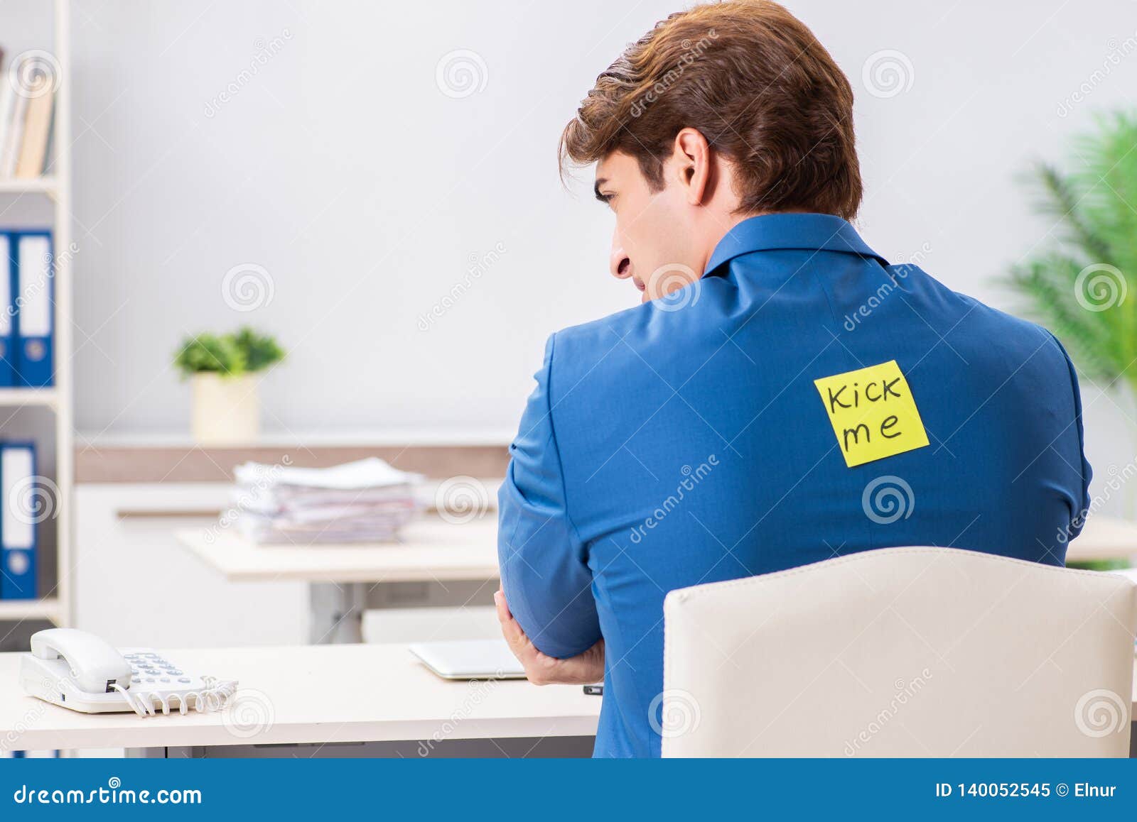 The Office Prank with Kick Me Message on Sticky Note Stock Image ...