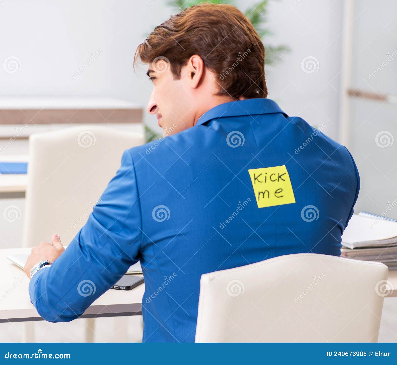 The Office Prank with Kick Me Message on Sticky Note Stock Image ...