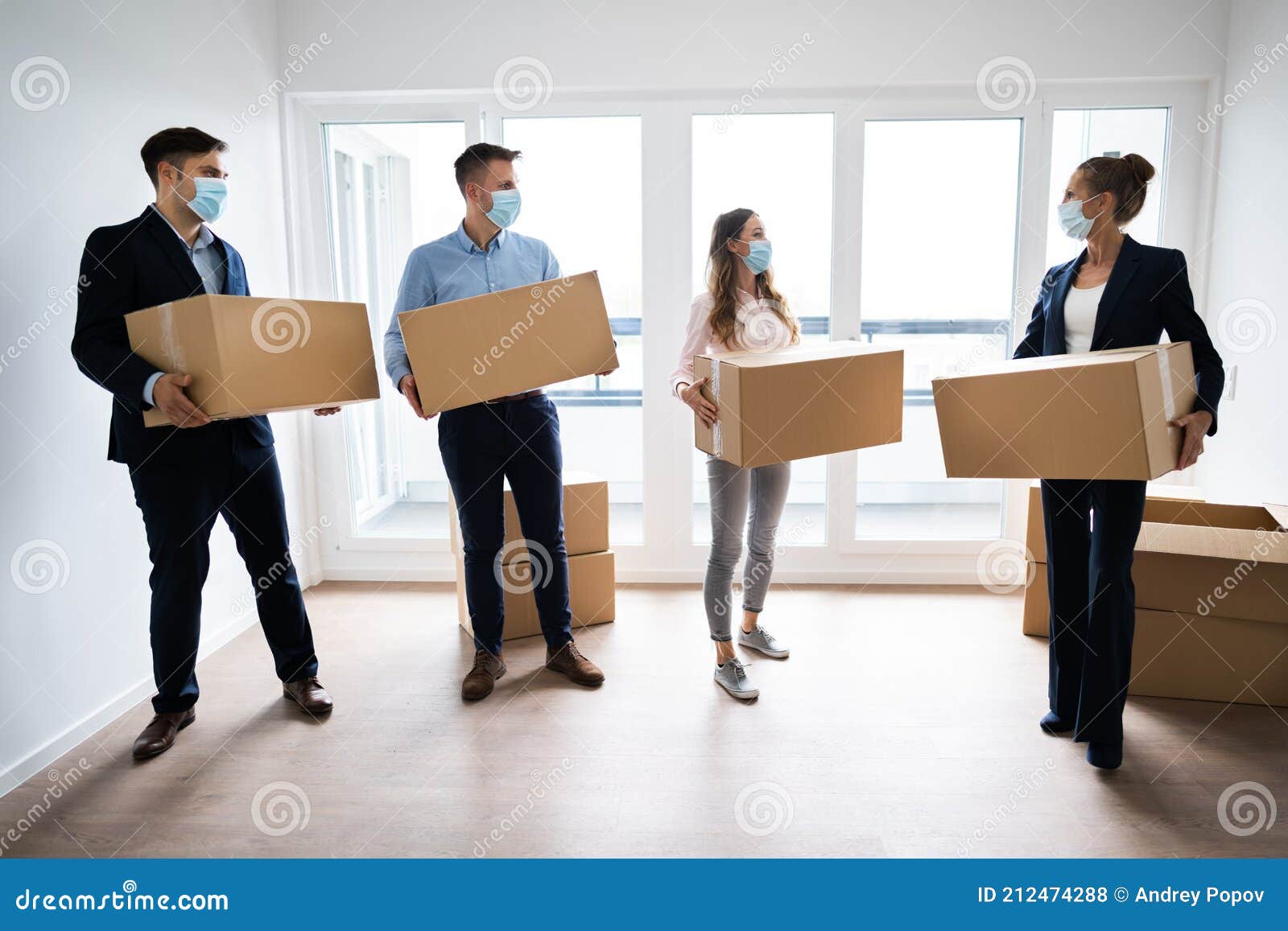 Office Relocation. Executives Moving Cardboard Boxes Stock Photo ...