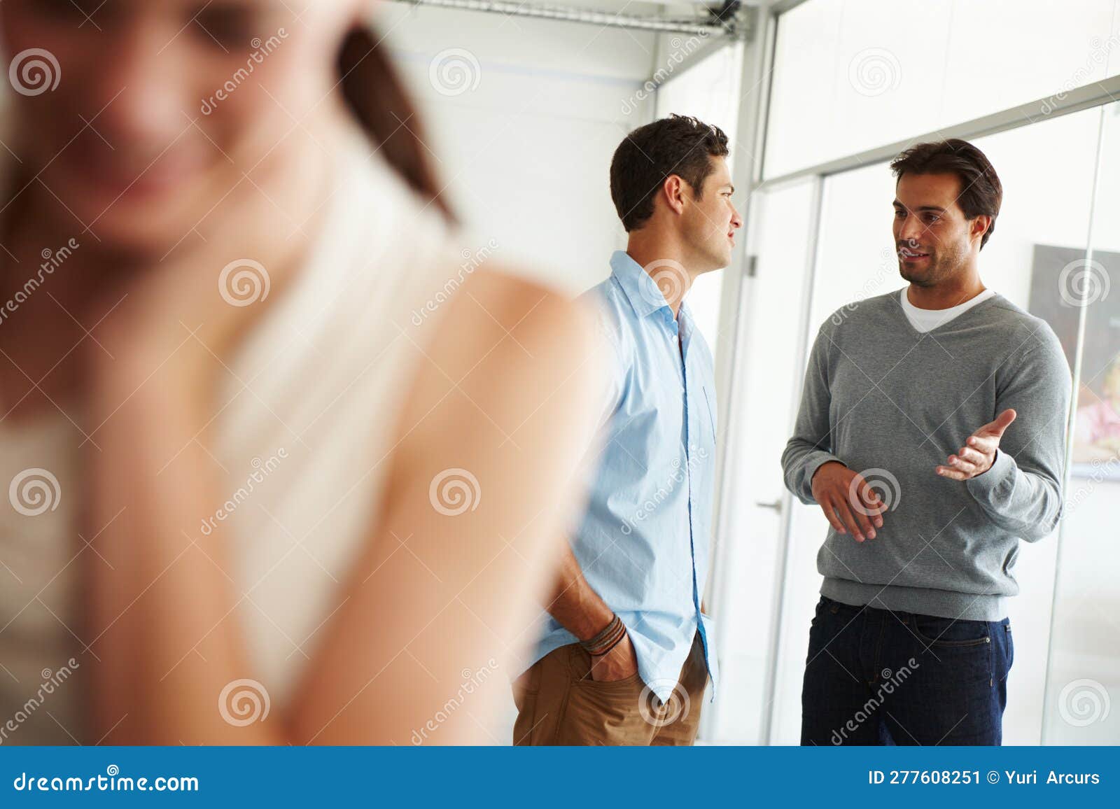 Office Scandal. Two Colleagues in the Office Gossiping about a Third ...