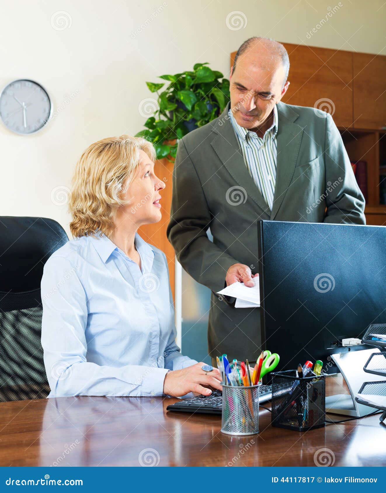 Office Scene with Two Mature and Serious Workers Stock Image - Image of ...