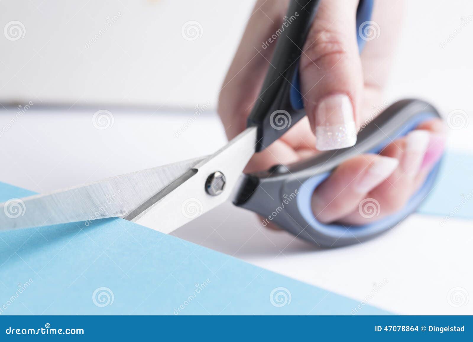 Office Scissor Cutting a Blue Cardboard Stock Photo - Image of ...
