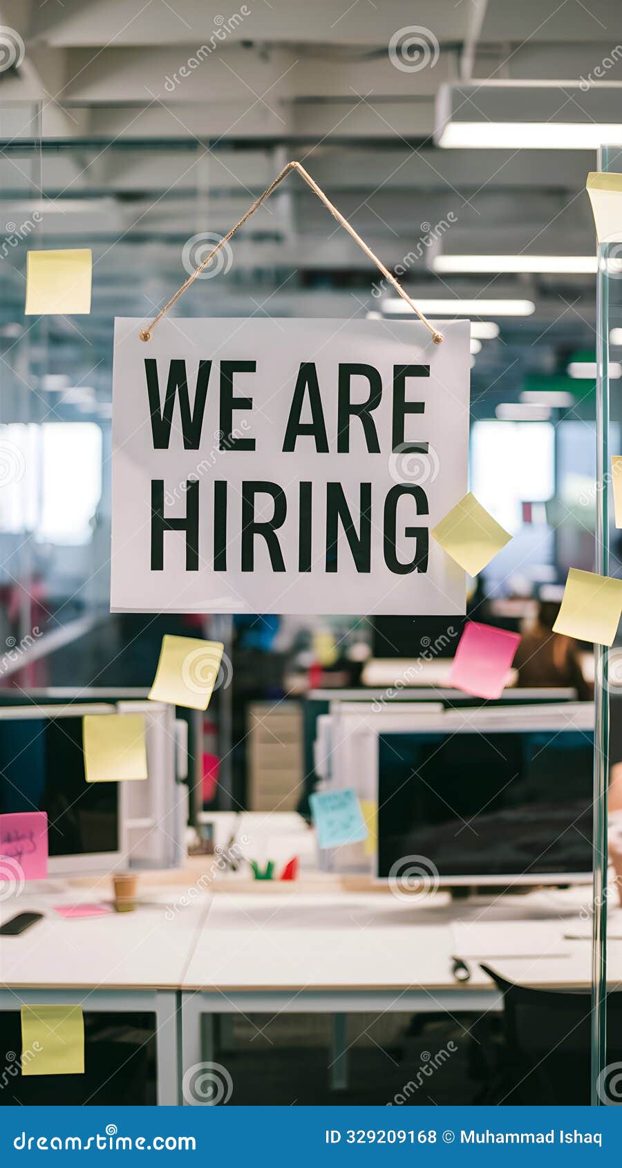 Office Setting with we are Hiring Sign Above a Desk, Open Workspace ...