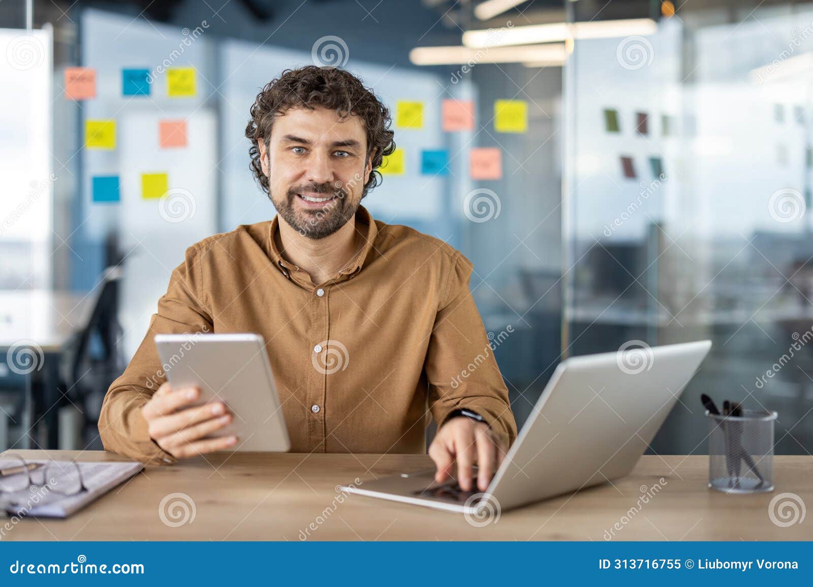 Professional Multitasking with Laptop and Tablet at Work Stock Image ...