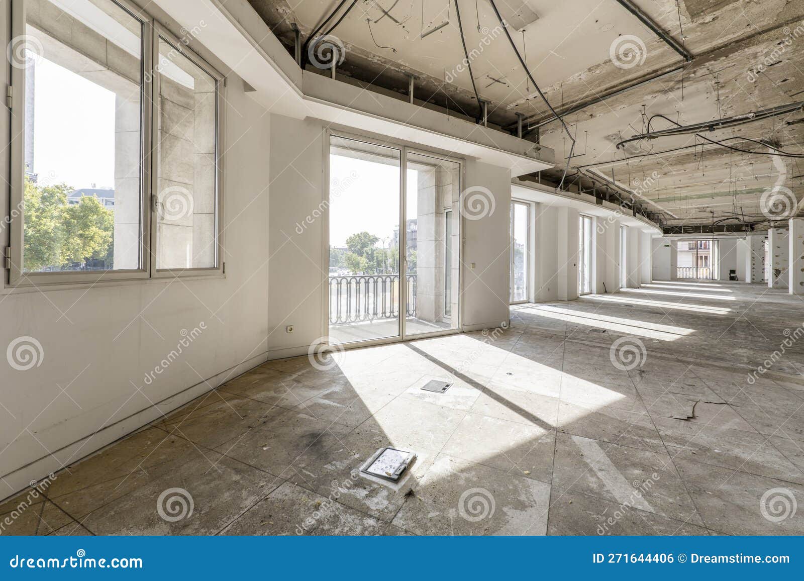 An Office Space Under Construction with Many Windows with Balconies in ...