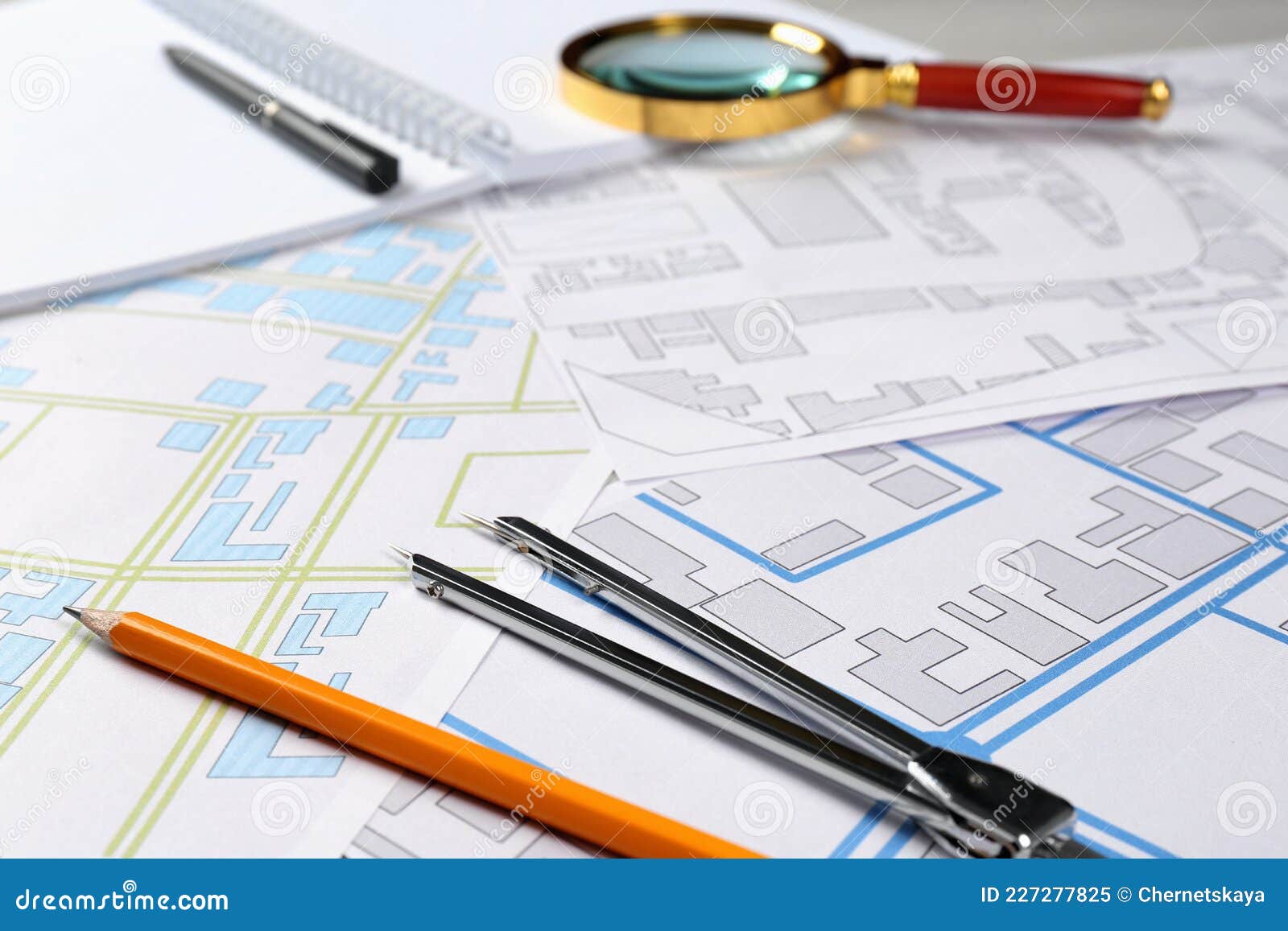 Office Stationery and Maps of Territory with Buildings on Table Stock ...