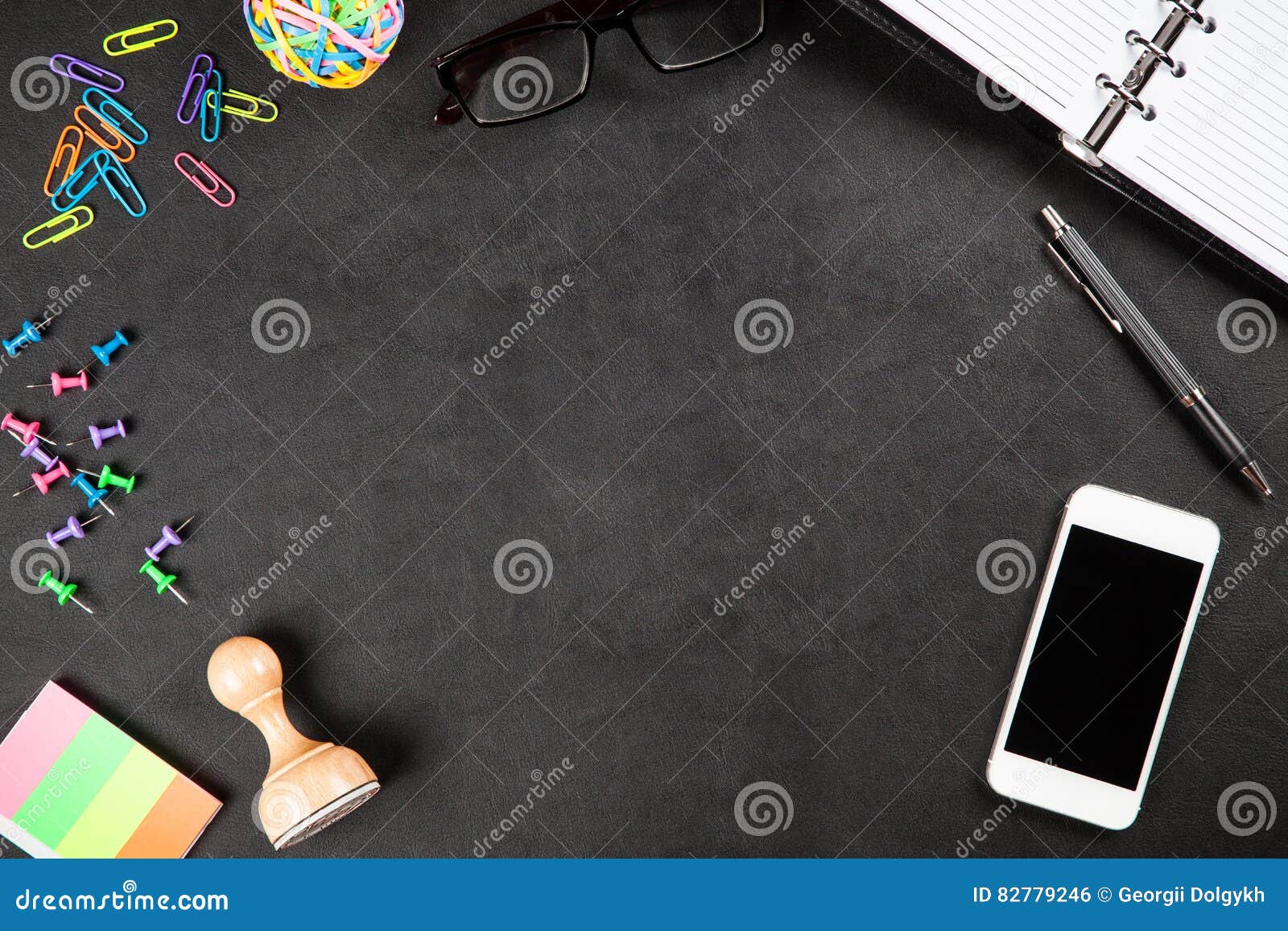 Office Supplies on a Black Table Stock Photo - Image of order ...