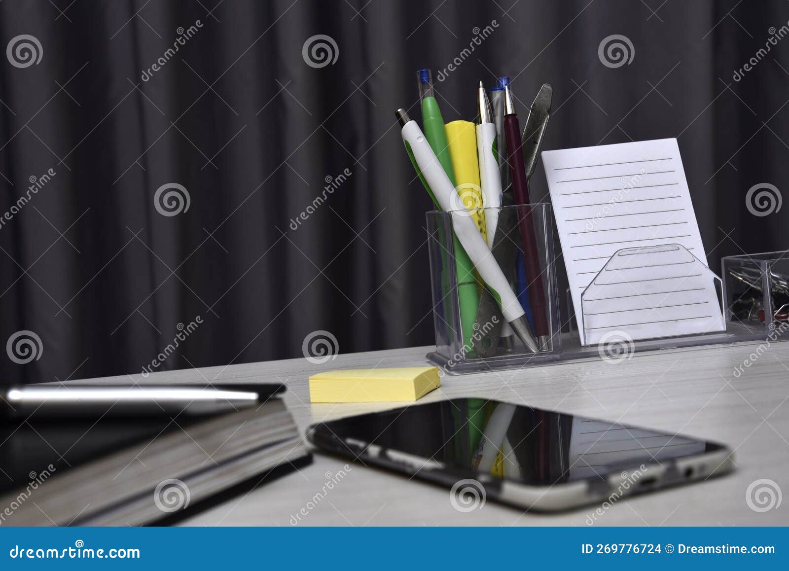 Office Table with Cell Phone Pens and Notepad Work Area Stock Photo ...