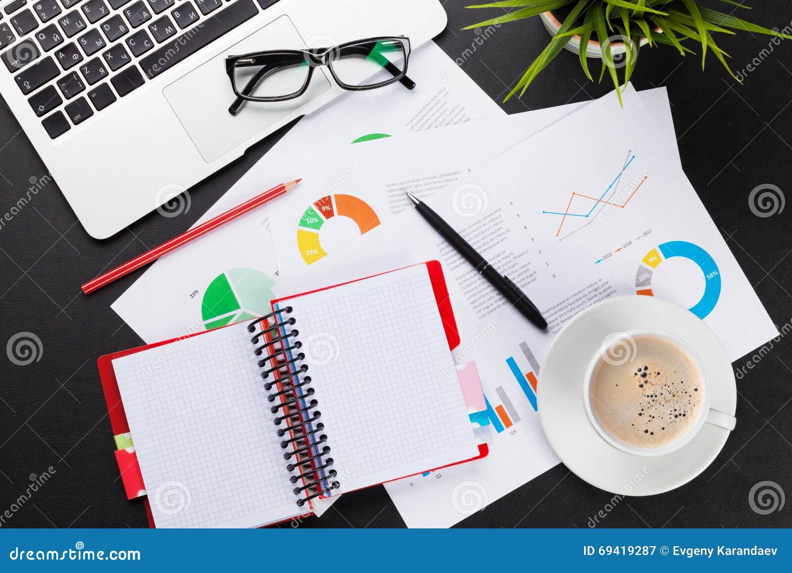 Office Table with Laptop, Coffee, Notepad and Reports Stock Image ...