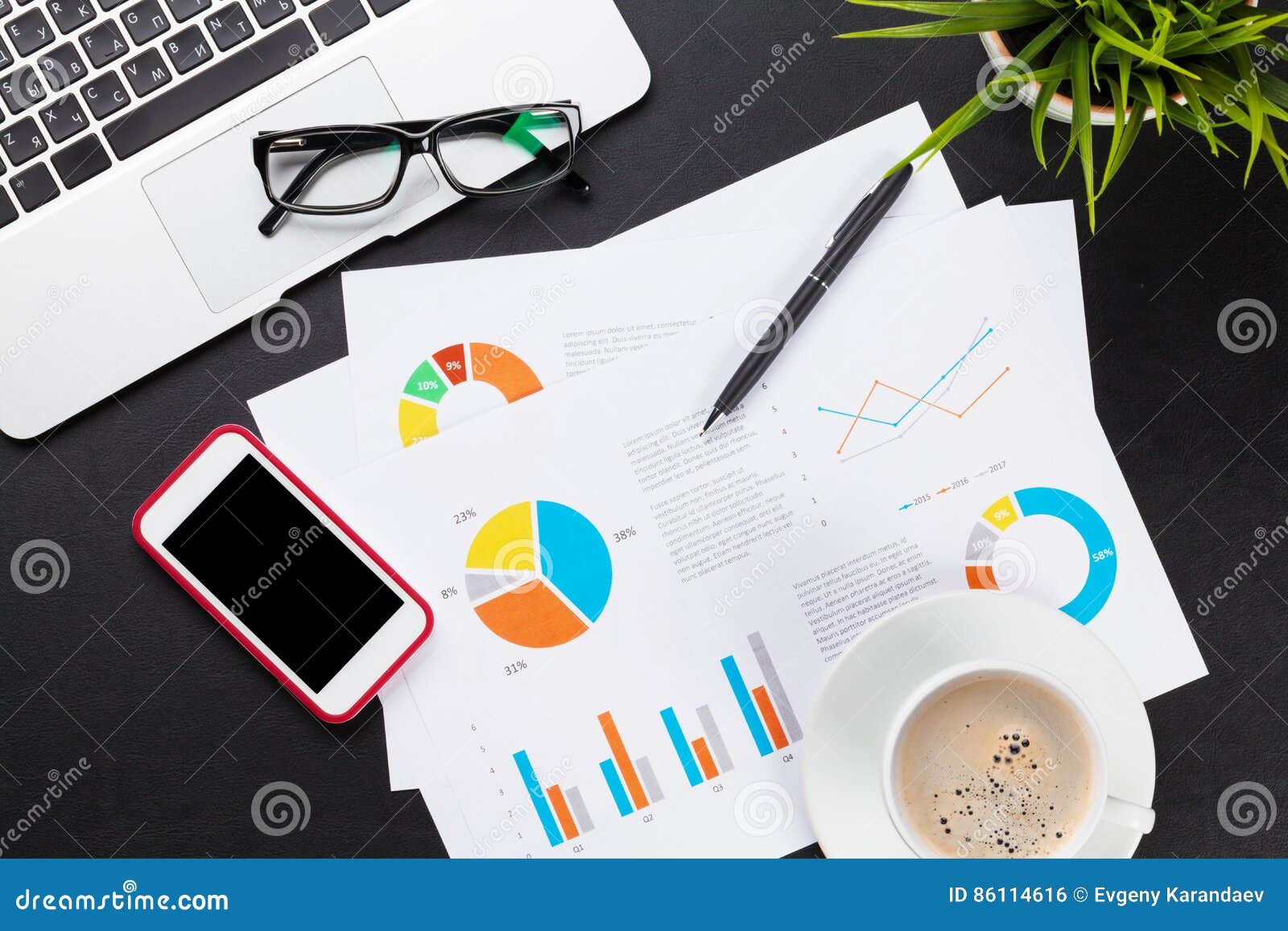 Office Table with Laptop, Coffee, Smartphone and Reports Stock Photo ...