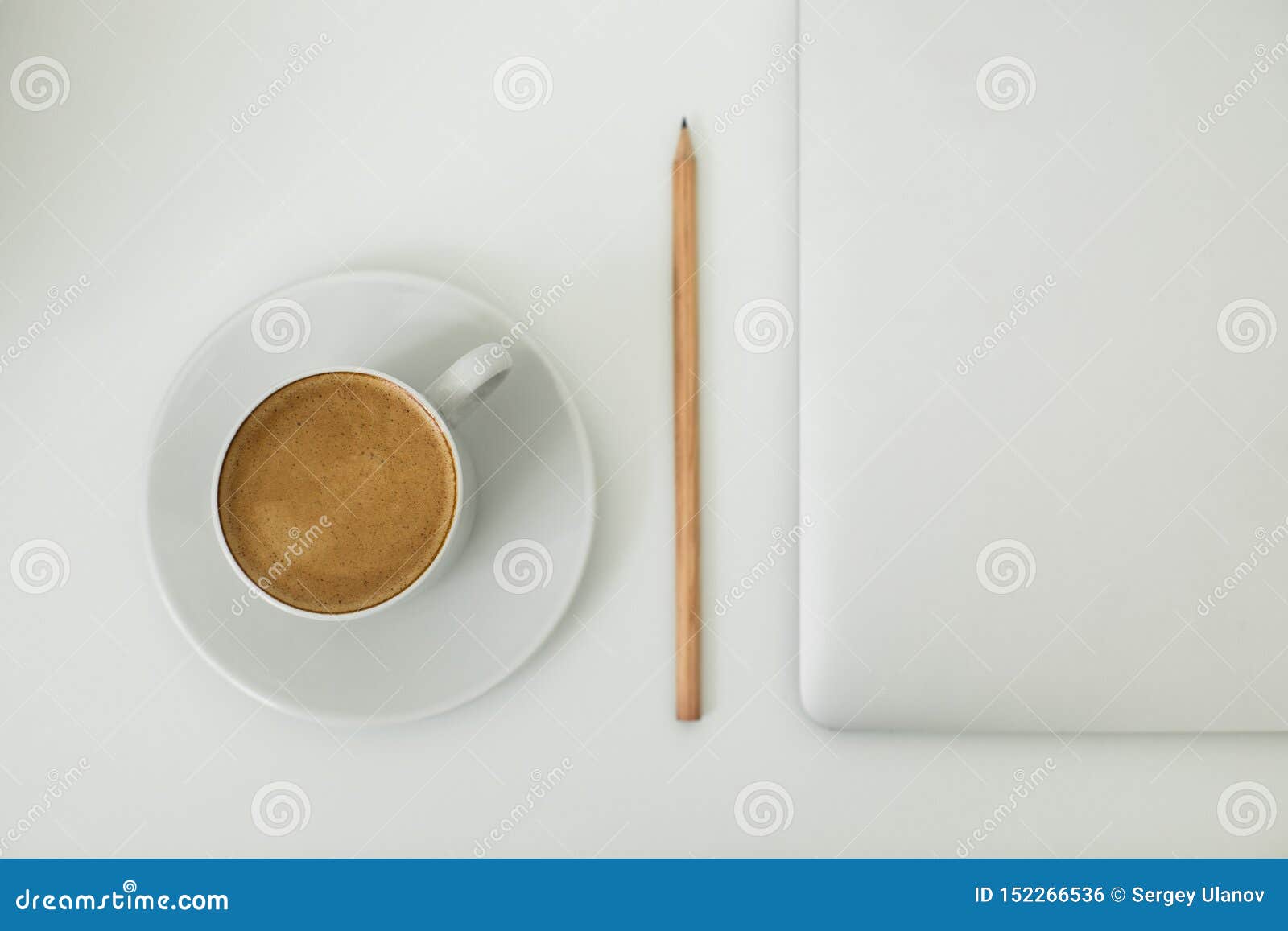 Office Table on Which Laptop, Coffee, Tablet, Camera and Other Items ...