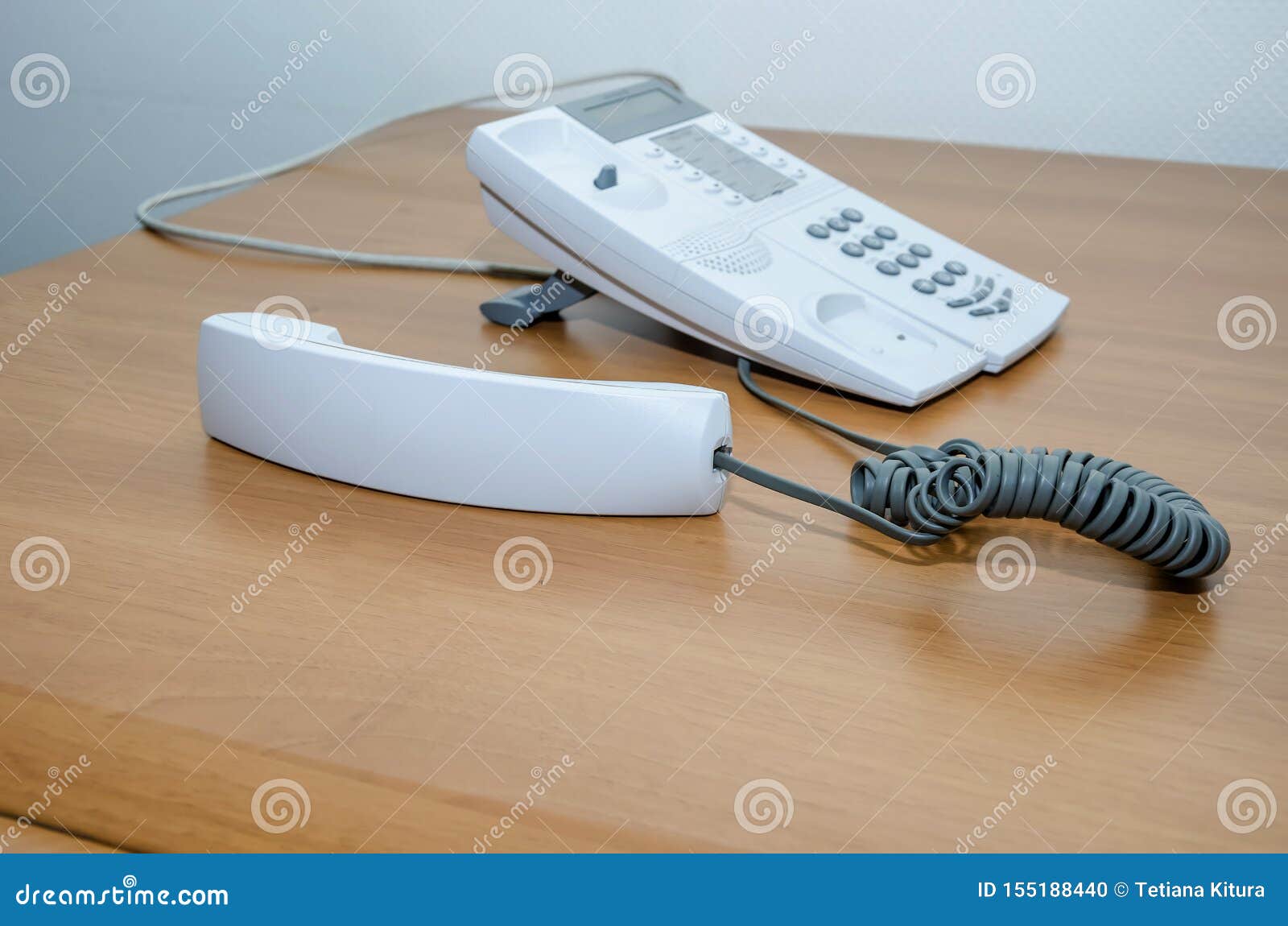Office Telephone Receiver and Telephone on a Wooden Office Desk Stock ...
