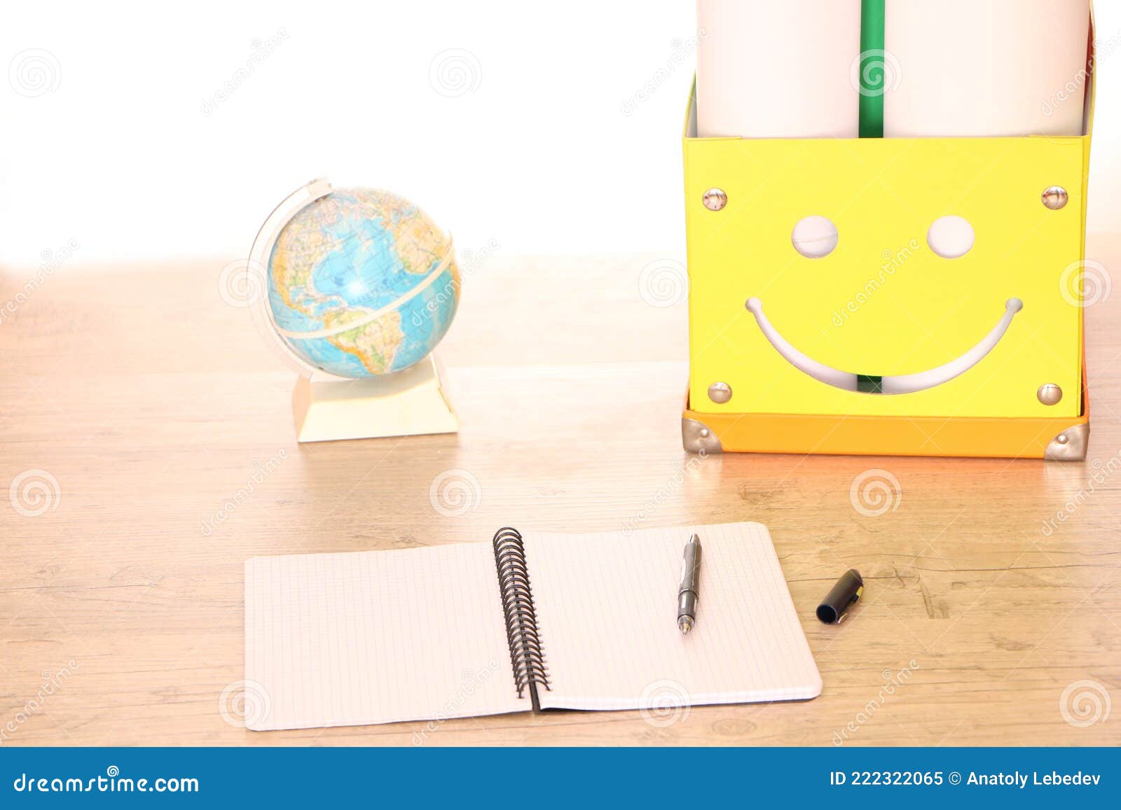 In the Office There is a Yellow Box with Documents and a Globe on the ...