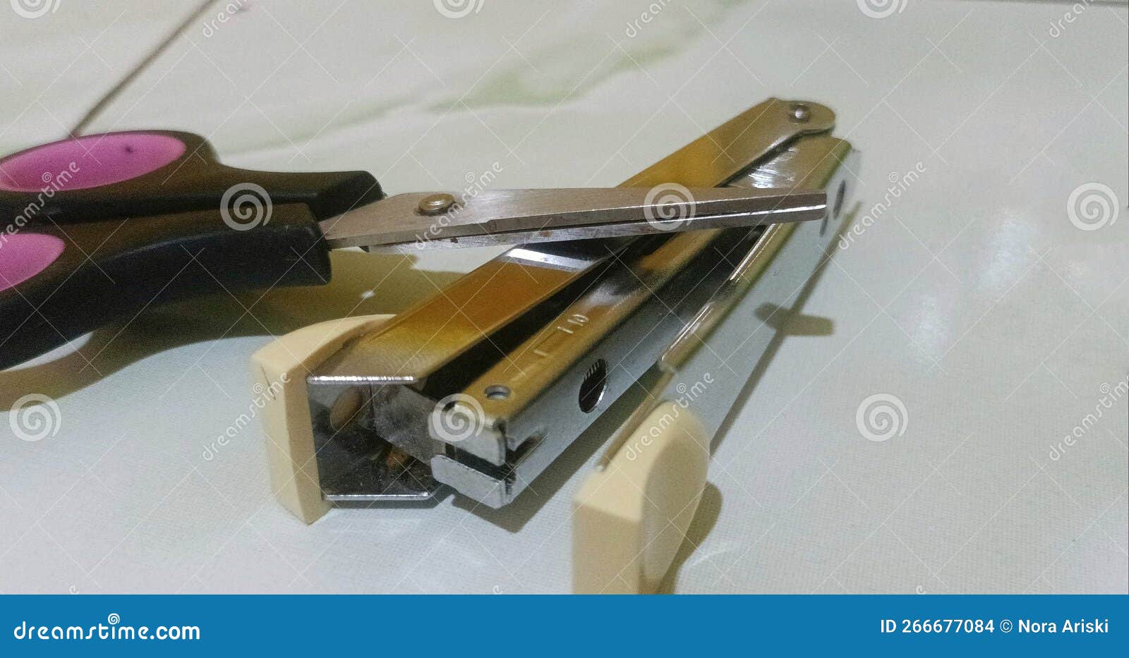 Office Tools in the Form of a Stapler and Scissors are Used To Combine ...