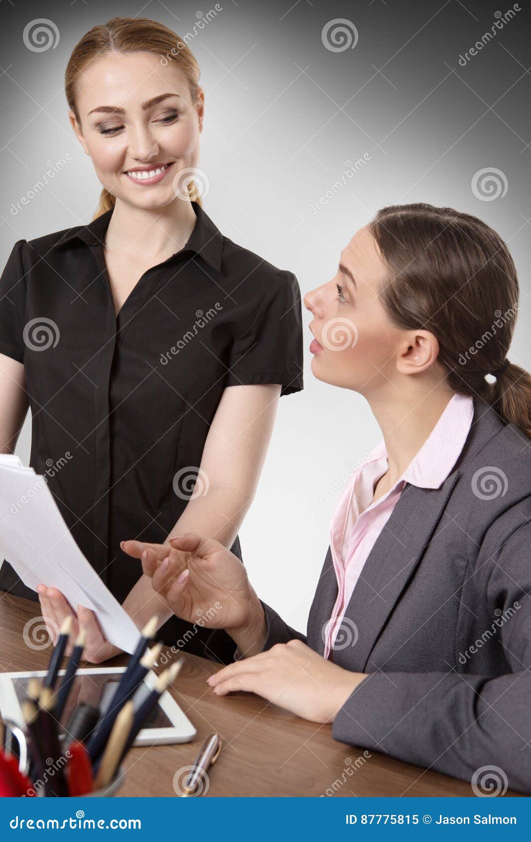 Office Women Looking at Documents Stock Image - Image of mentor ...