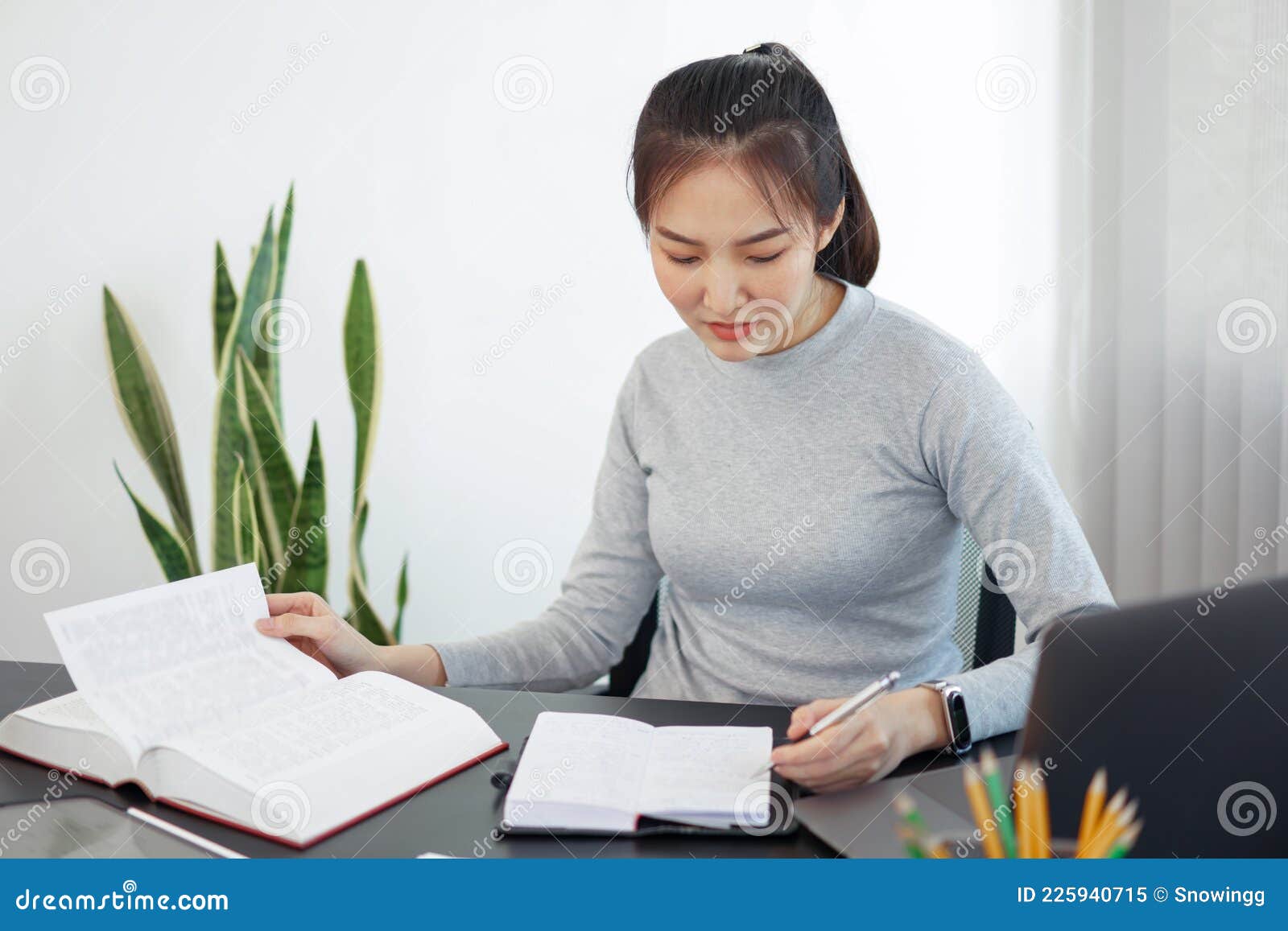 Office Work Concept a Female Secretary Writing Some Information into a ...