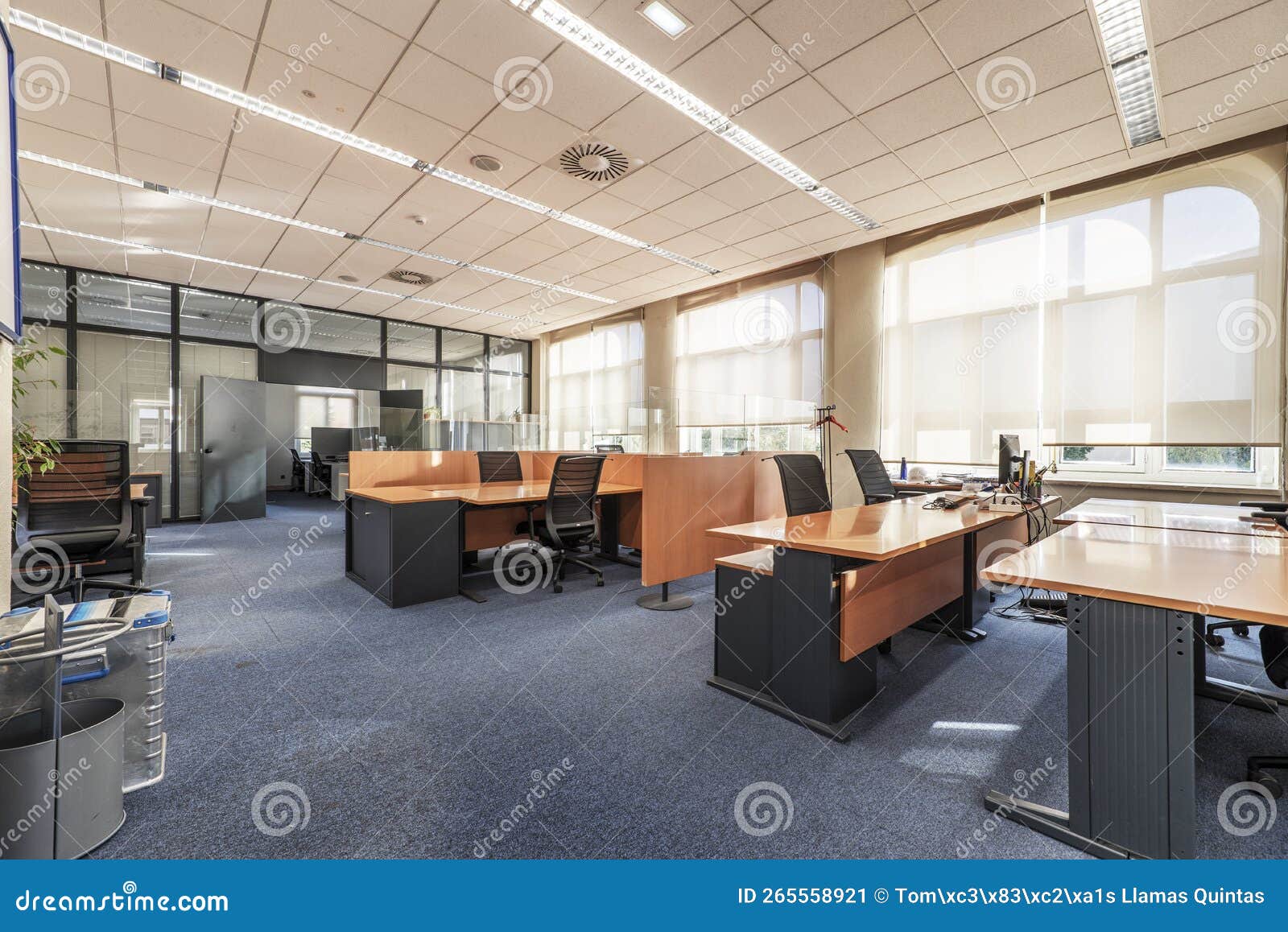 Office with Work Desks in Rows and Office Fish Tanks in the Background ...