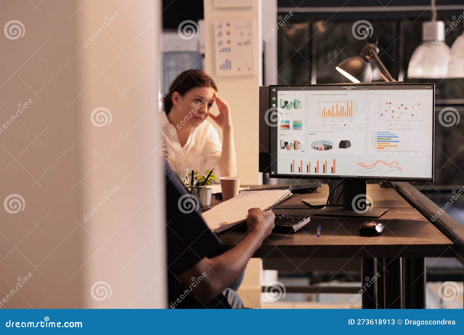 Office Worker Analyzing Analytics Report Data On Computer Stock Image