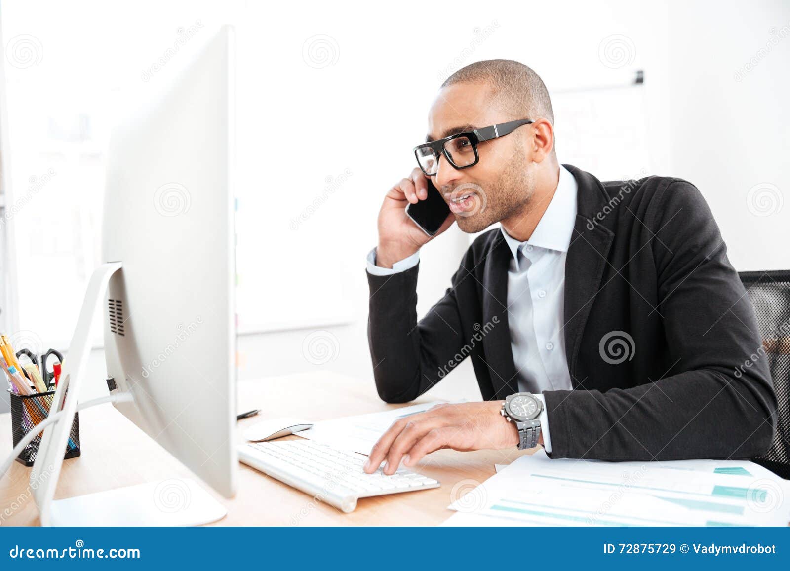 Office Worker Calling on the Phone and Reading Business Document Stock ...