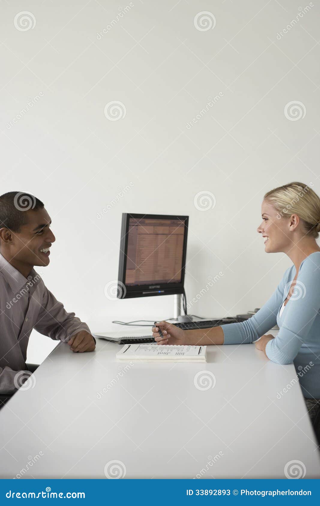 Office Worker and Client Sitting at Desk Stock Image - Image of ...