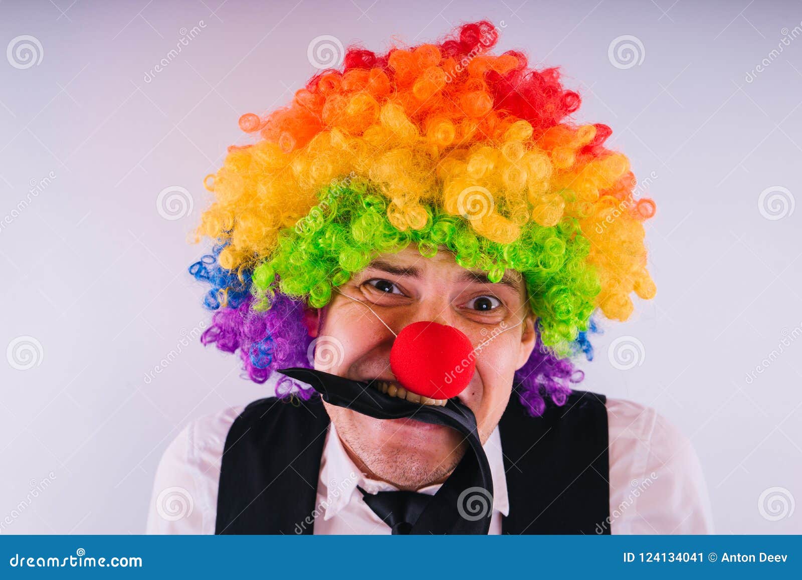 Office Worker in Clown Wig, Clown Concept at Work. Businessman with ...