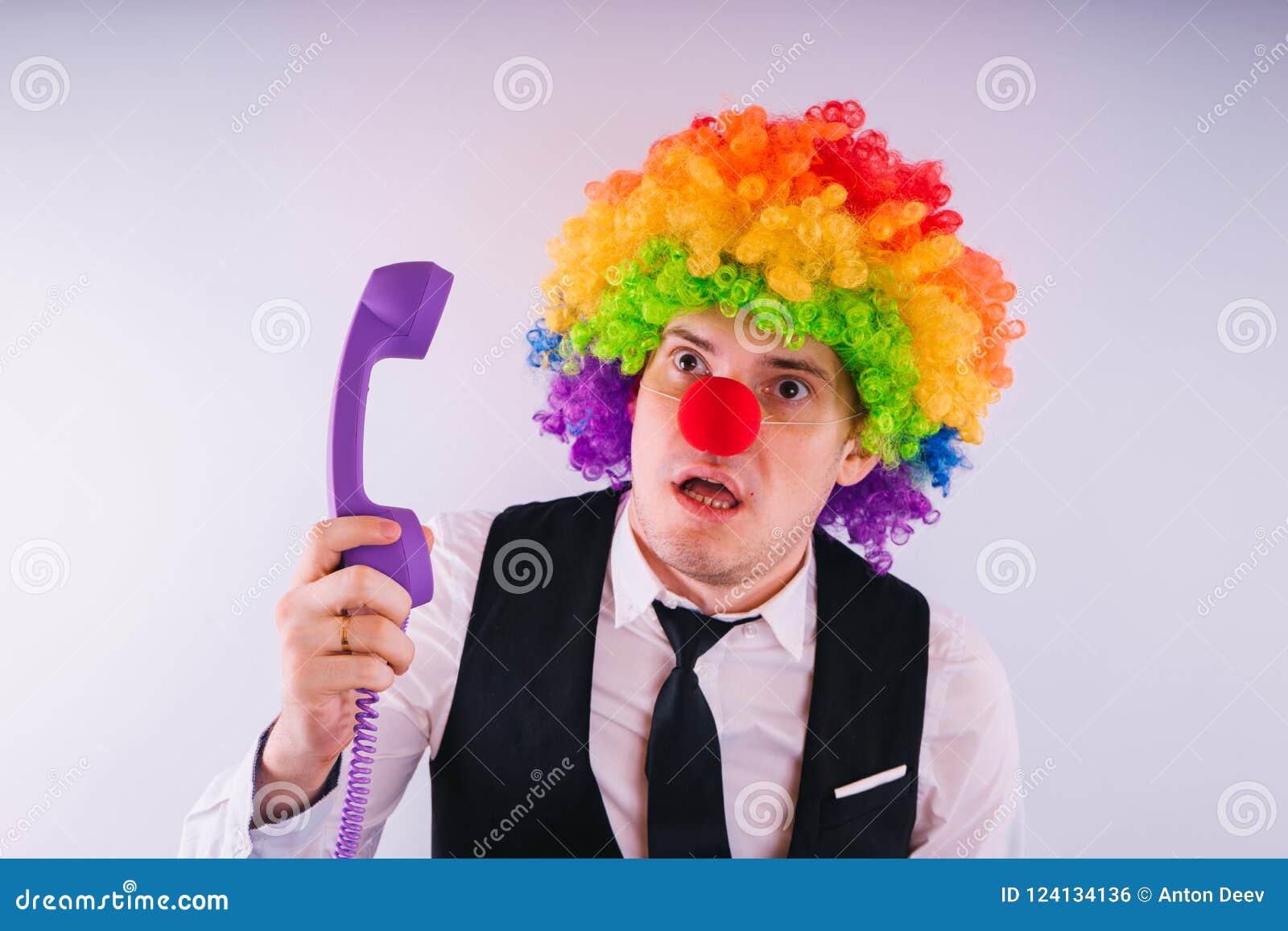 Office Worker in Clown Wig, Clown Concept at Work. Businessman with ...