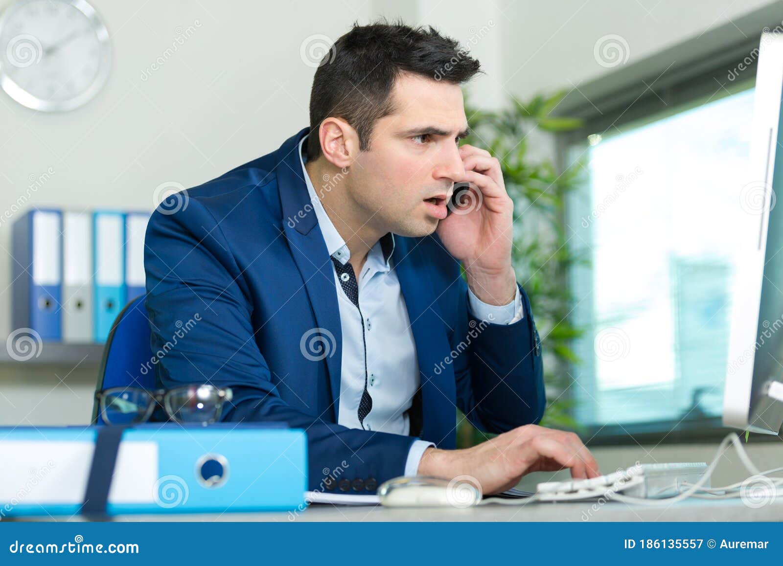 Office Worker Discovering Shocking Information from Internet Stock ...