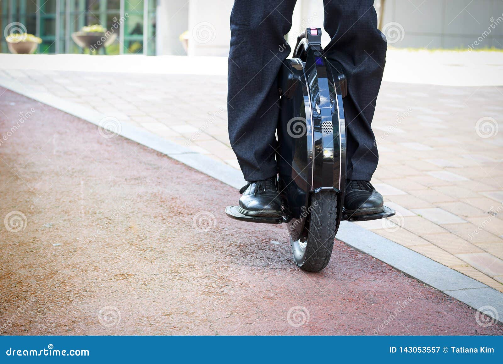 Office Worker is Driving on an Electric Mono Wheel, Front View Stock ...
