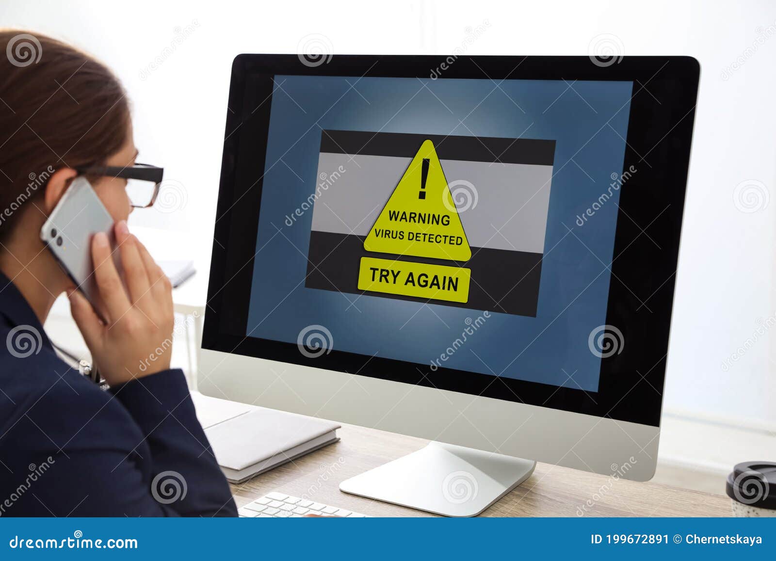 Office Worker in Front of Computer with Warning about Virus Attack on ...