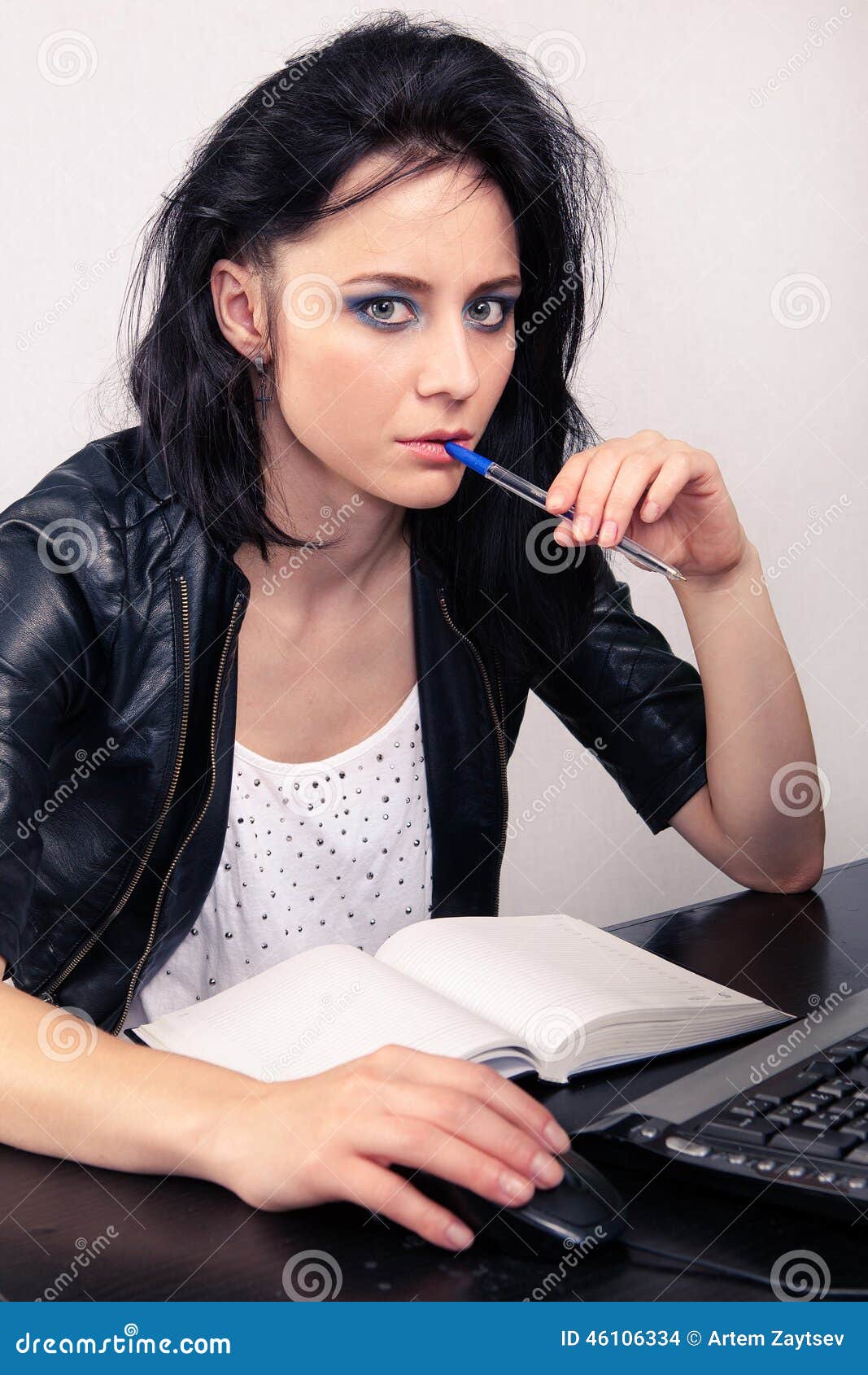 Office Worker Girl Working on a Computer and Does Records in a Diary ...