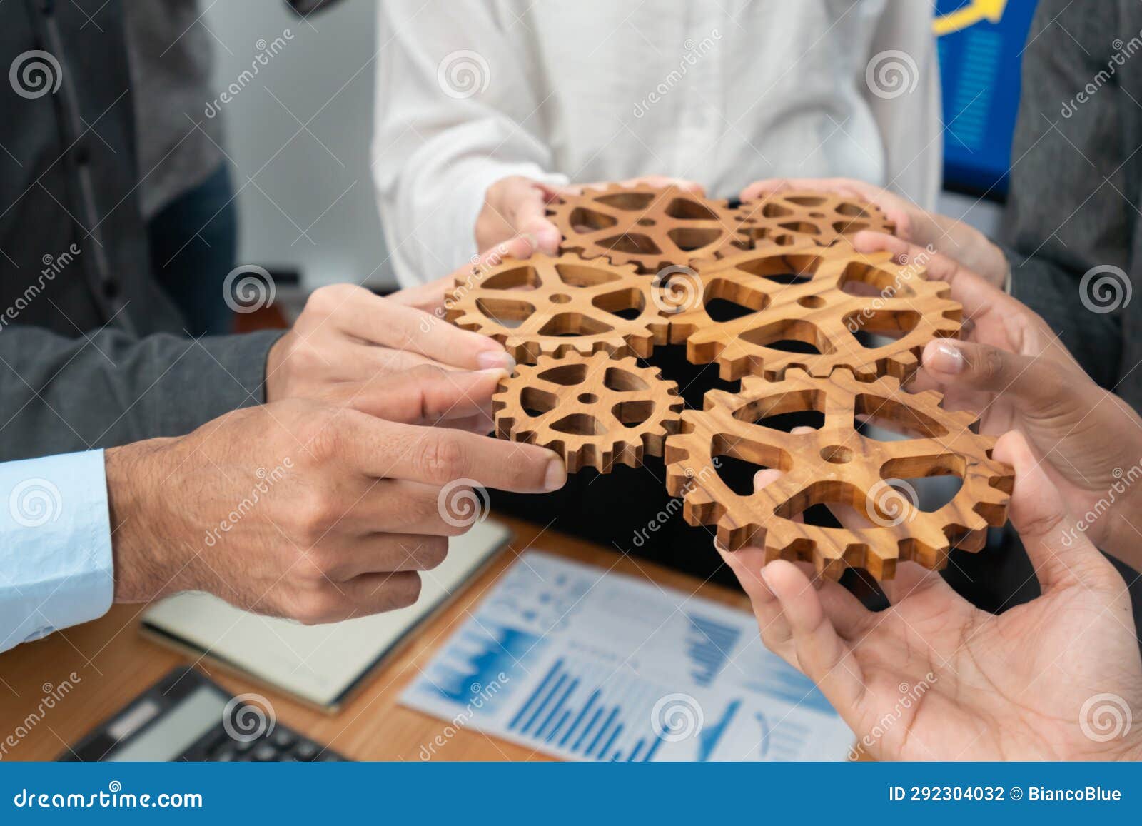 Office Worker Holding Cog Wheel As Unity and Teamwork in Workplace ...