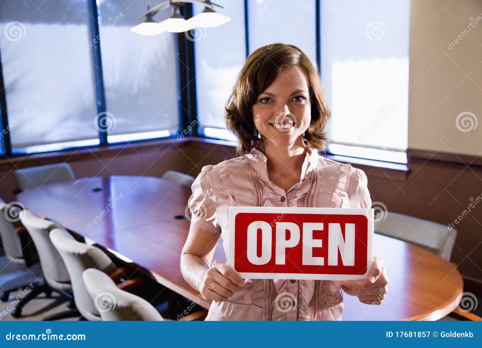 Office Worker Holding Open Sign in Empty Boardroom Stock Image - Image ...