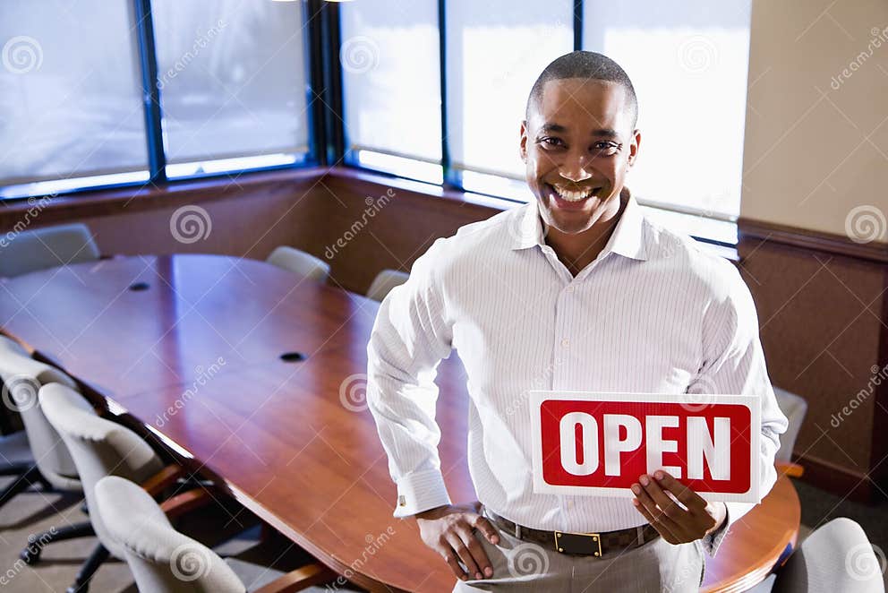 Office Worker Holding Open Sign in Empty Boardroom Stock Photo - Image ...